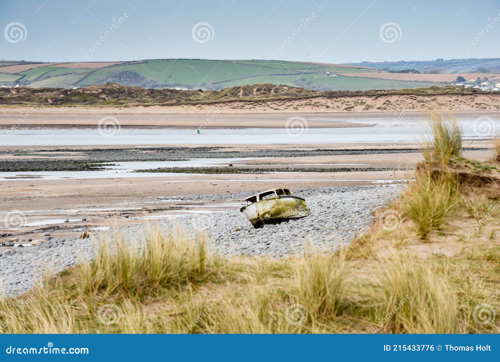 Ship Wreck of an Old Boat Washed Up on a Rocky Beach Stock Photo ...