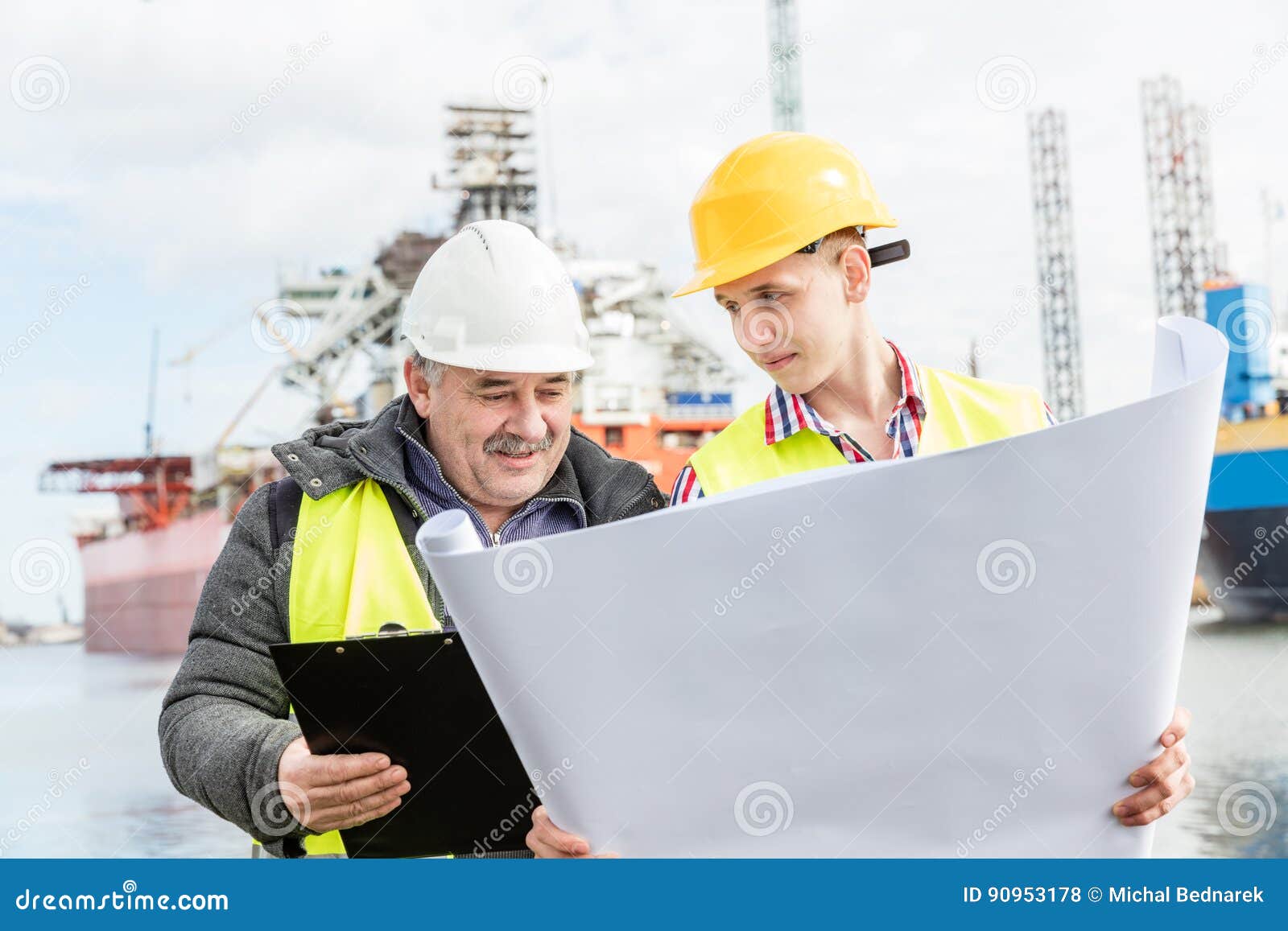 Shipbuilding Engineer Explains Technical Matters with a Student Worker ...