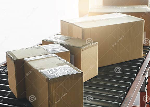 Shipment Boxes. Packaging Cardboard Boxes Sorting on Conveyor Belt in ...