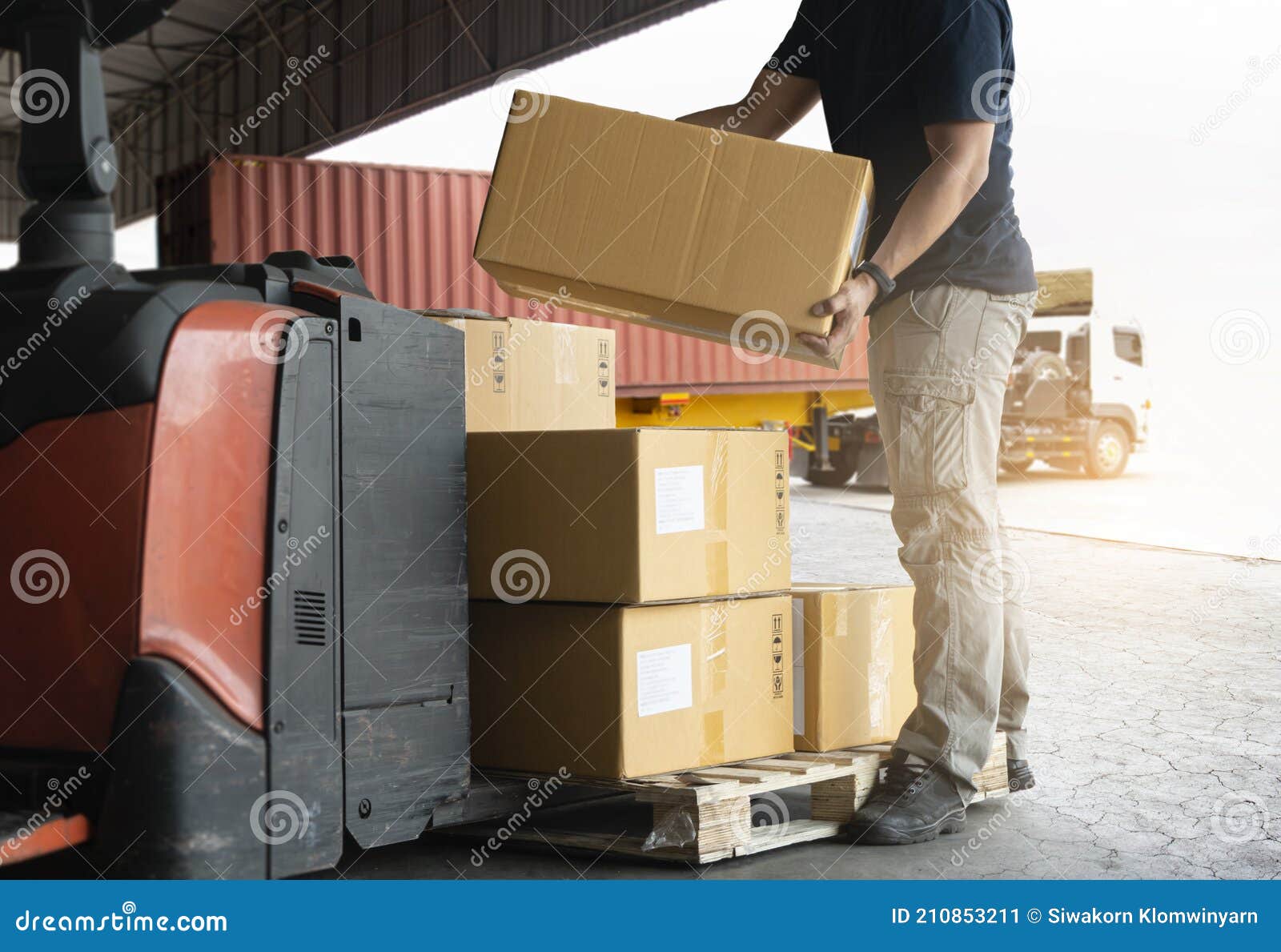 Shipment Boxes. Warehouse Worker Lifting Cardboard Boxes Stack on ...
