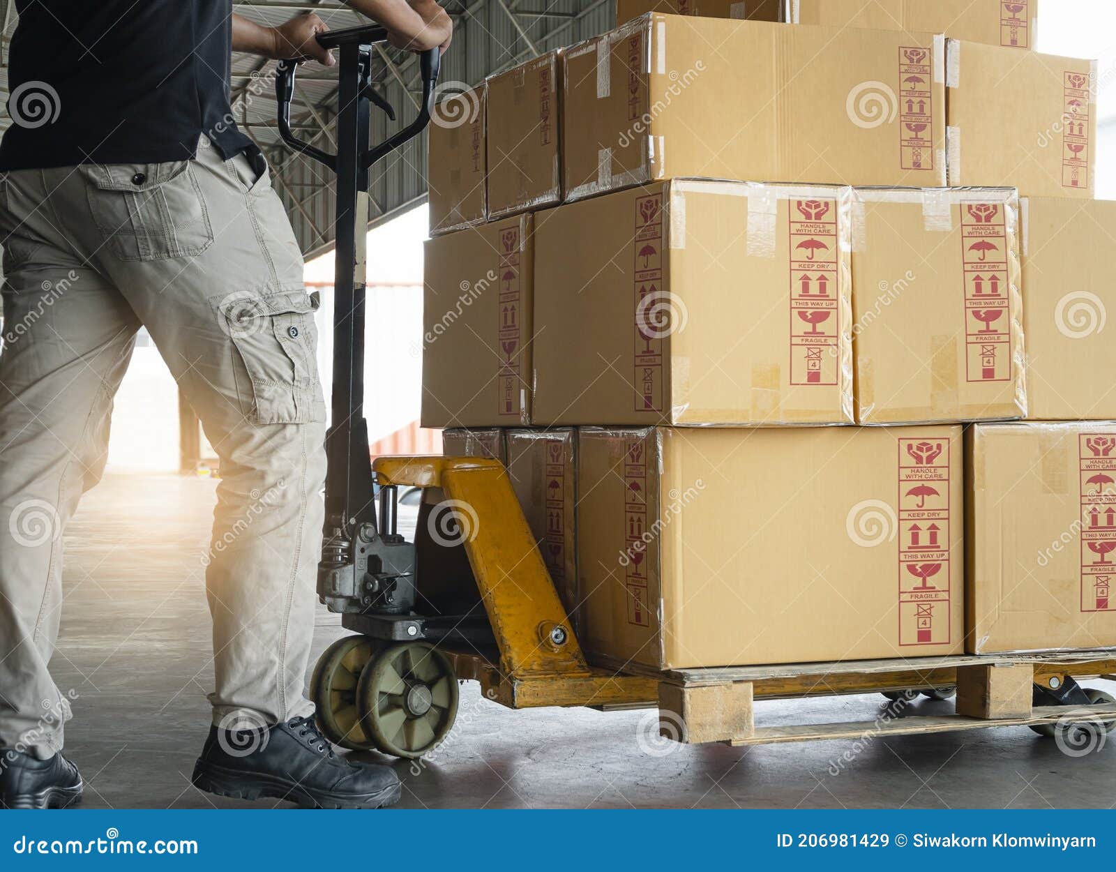 Shipment Boxes, Warehousing. Worker Working with Hand Pallet Truck ...