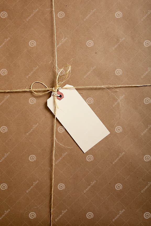 A Shipping Box Ties with String with a Blank Label Stock Photo - Image ...