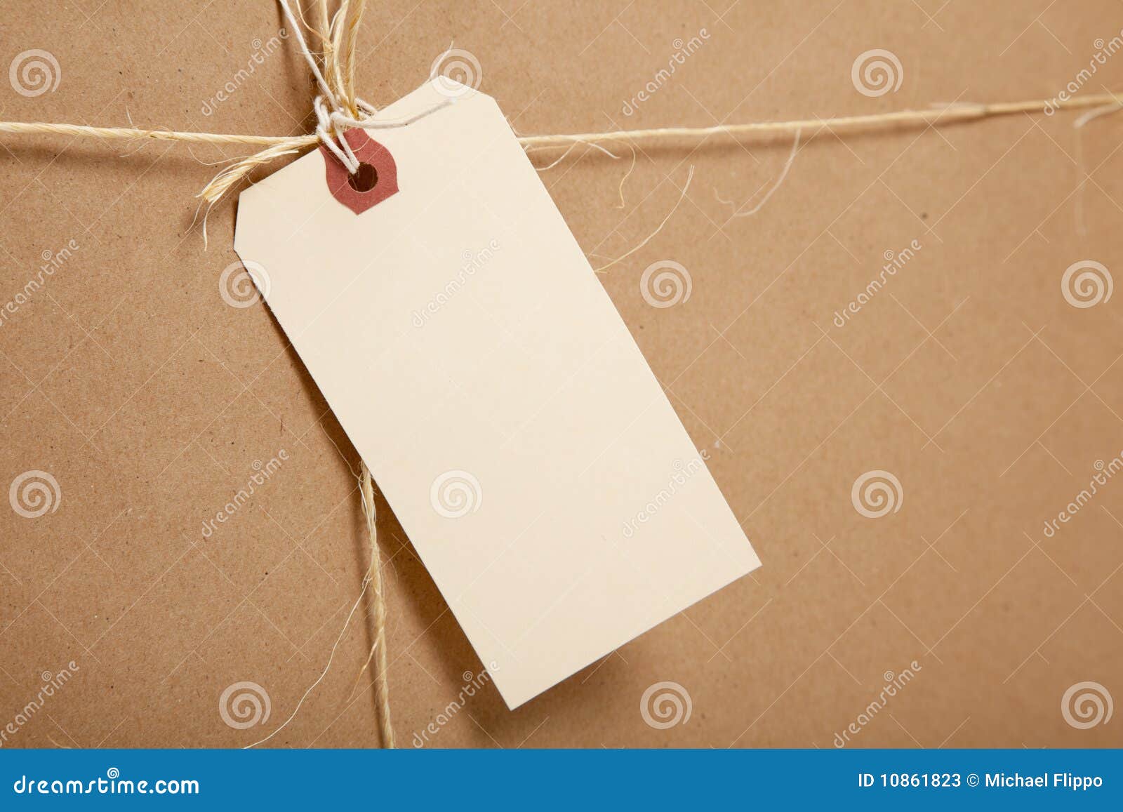 A Shipping Box Ties with String with a Blank Label Stock Image - Image ...