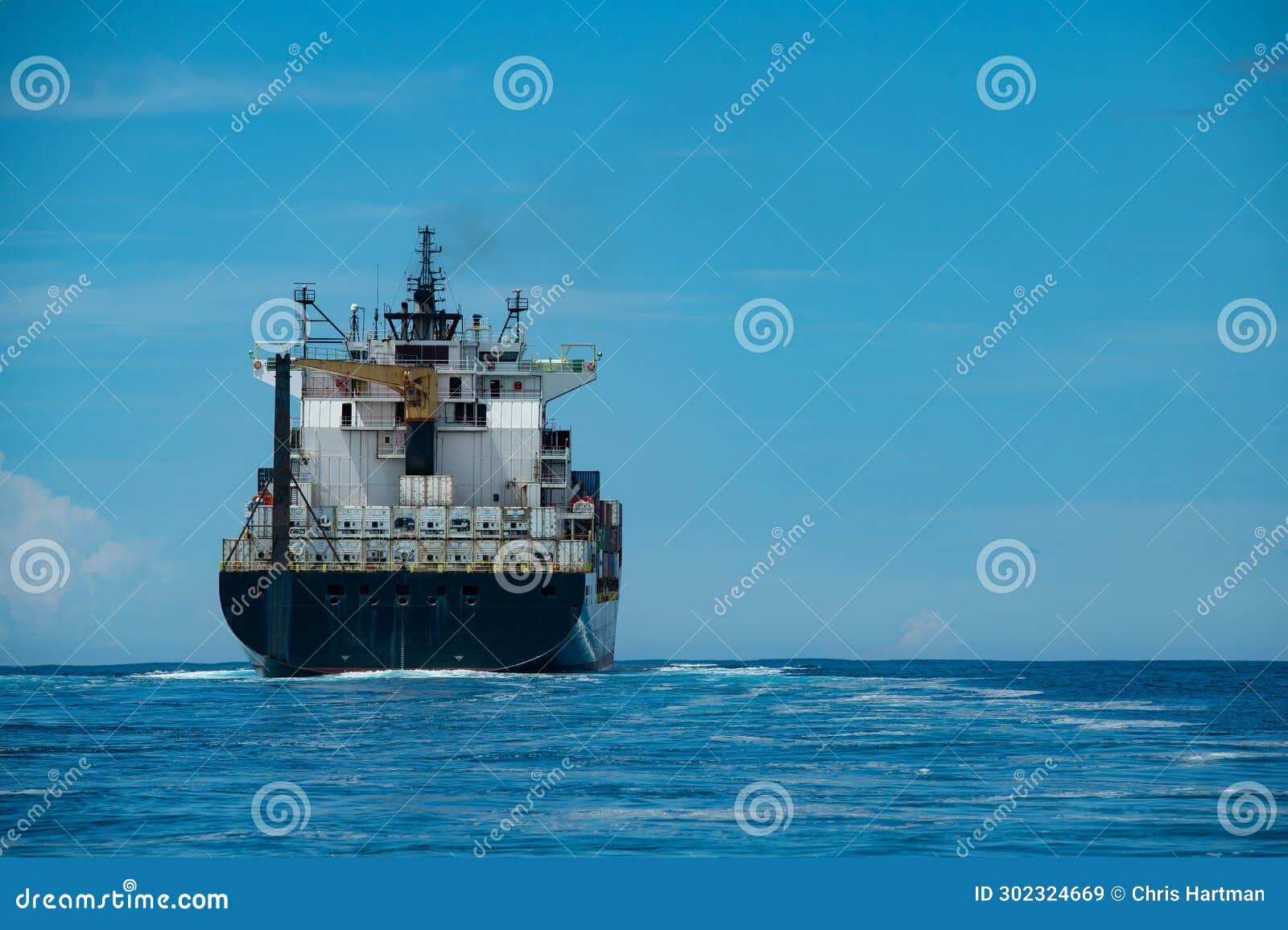 Shipping Container on a Blue Ocean with Blue Skies Stock Image - Image ...