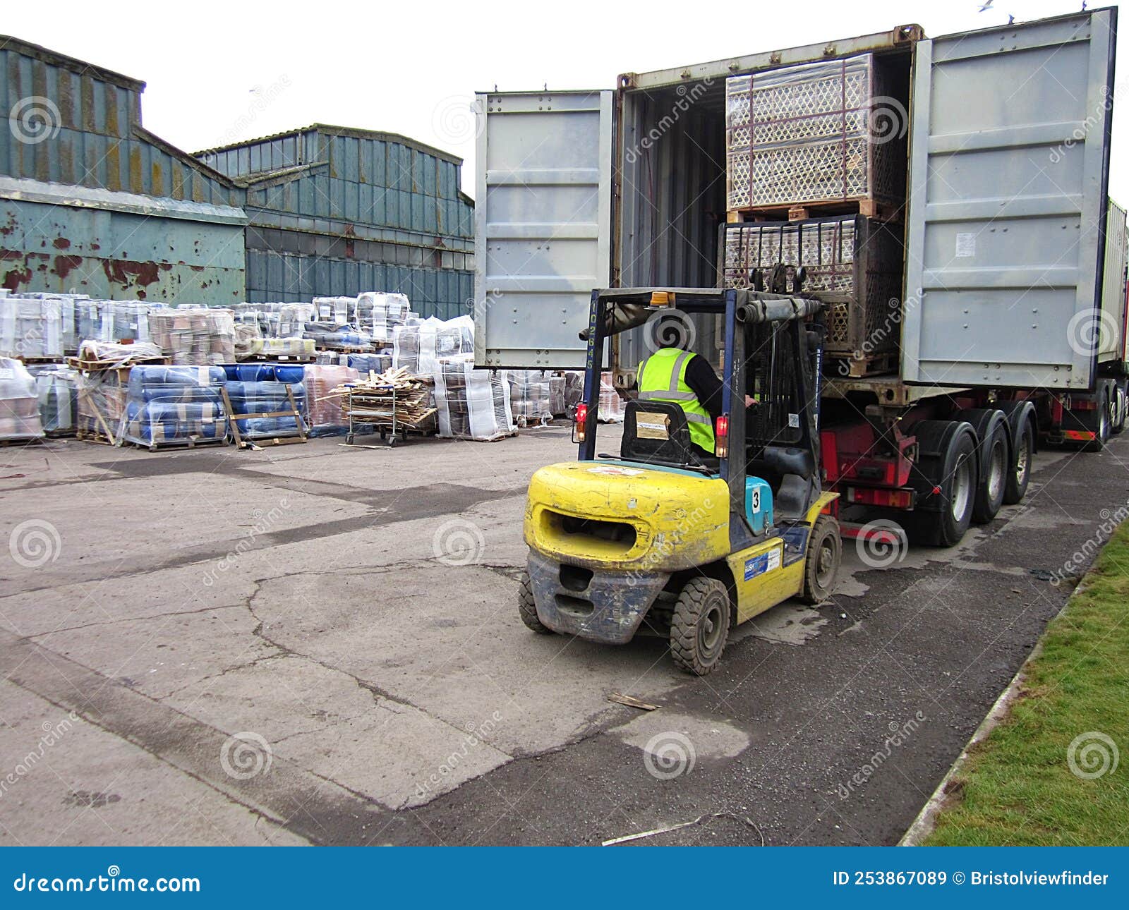 Shipping Containers Being Unloaded with Forkliift Editorial Stock Image ...