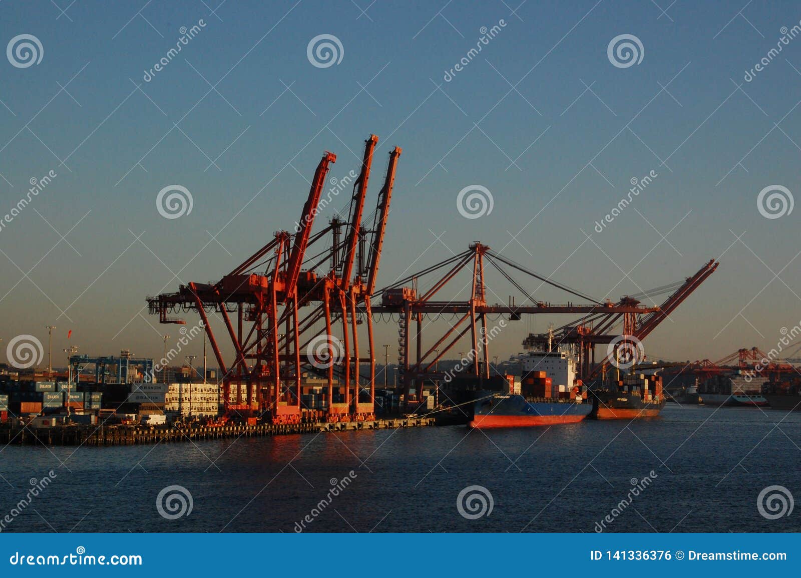 Shipping Cranes on a Waterfront Editorial Photo - Image of water, clear ...