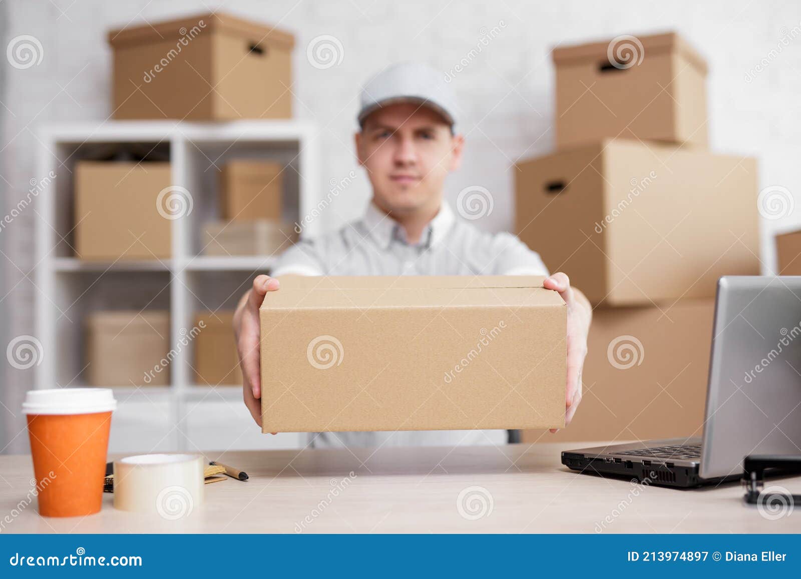 Shipping and Postal Delivery Concept - Close Up of Parcel in Postman ...