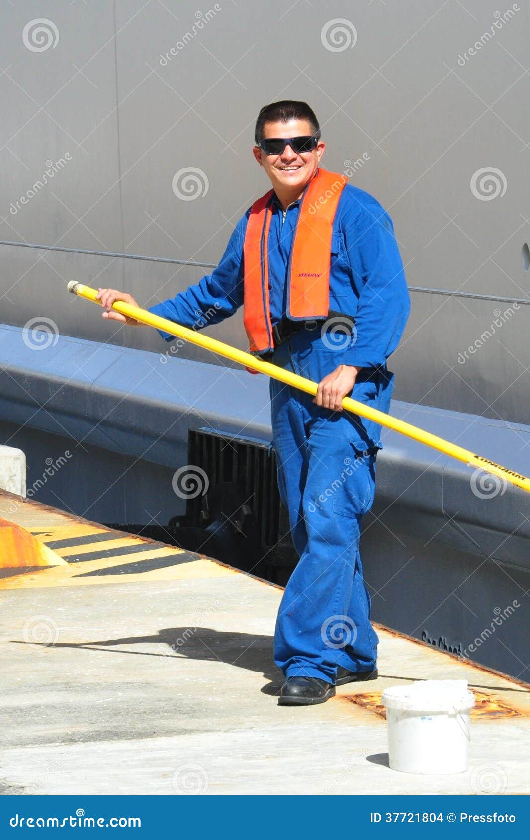 Crew Member With Orange Jacket And Helmet Checking Aft Hook On Life ...