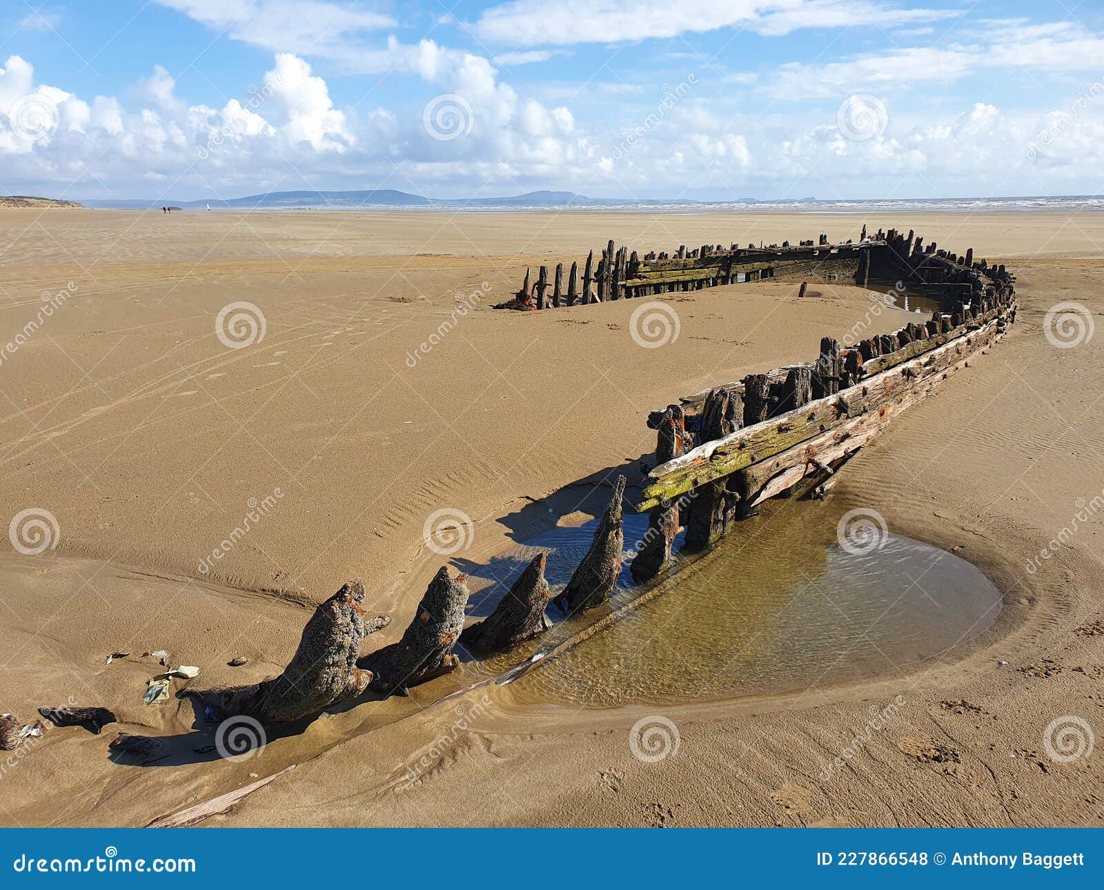 Shipwreck On The Cefn Sands Beach At Pembrey Country Park In