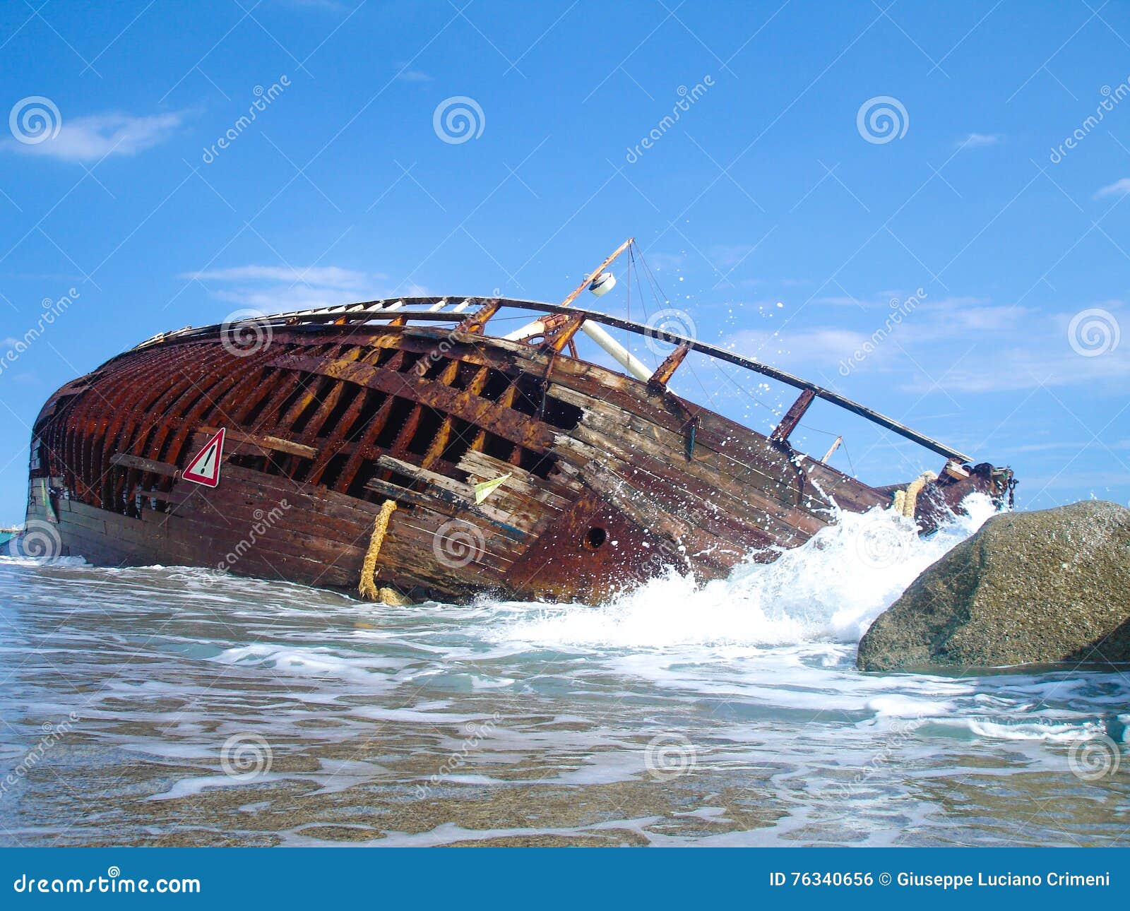 Shipwreck of a Sailing Ship after a Storm with Blue Sky. Stock Photo ...
