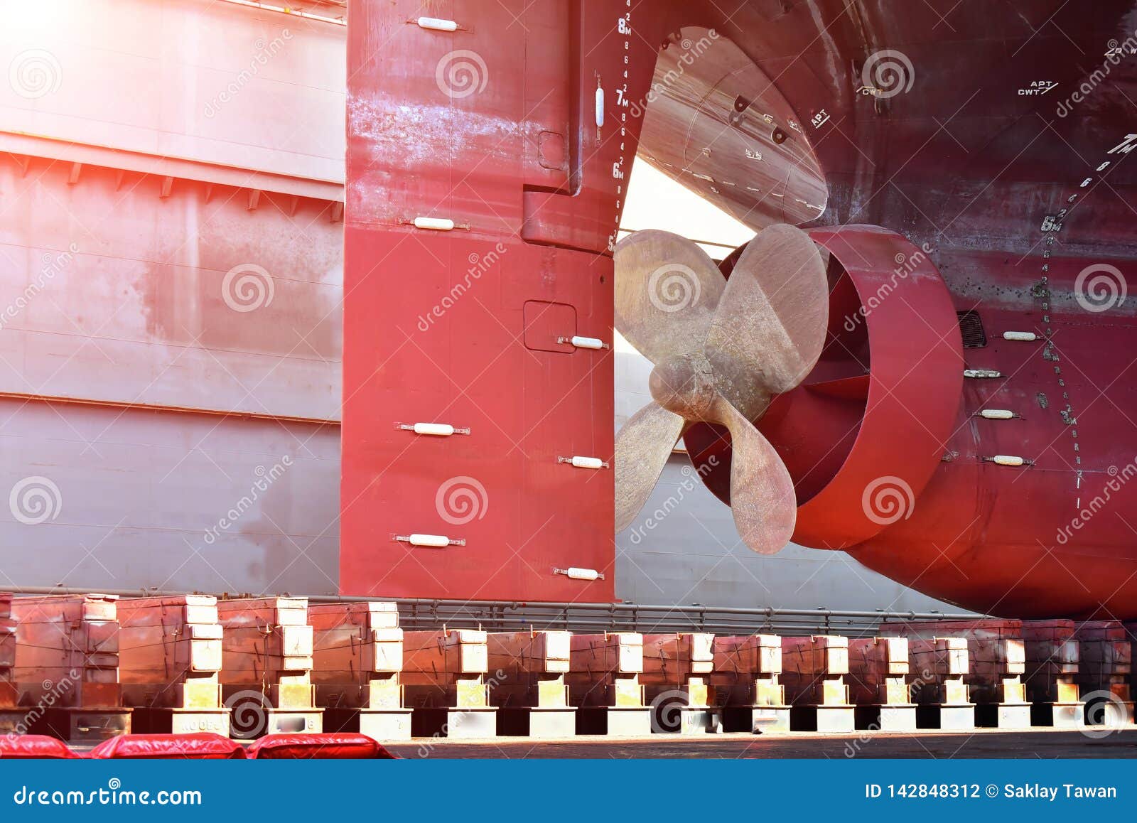 Propeller And Rudder Of Fishing Boat Beside Rusty Barge Stock ...