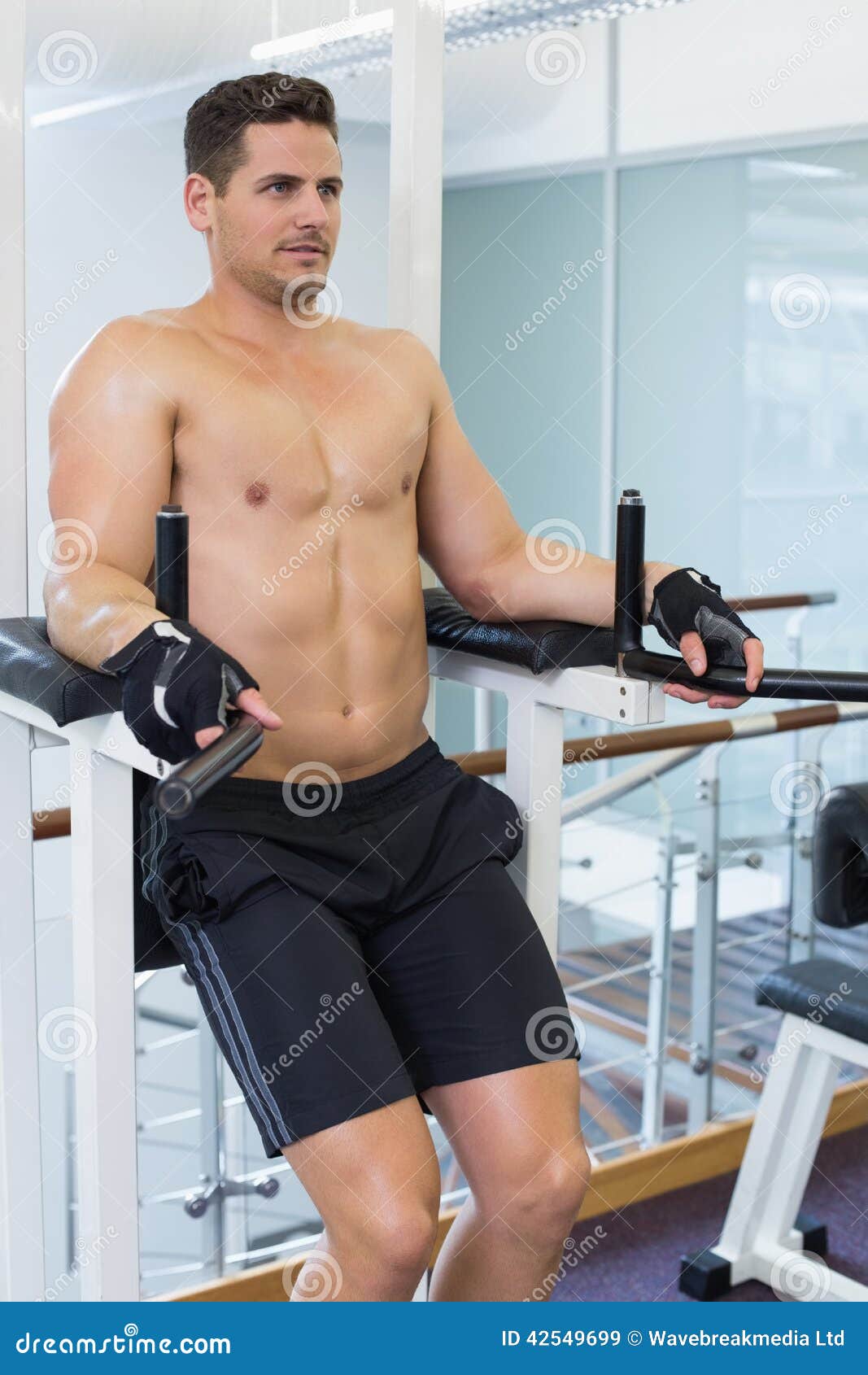 Shirtless Bodybuilder Doing Leg Lifts Stock Image - Image of side ...