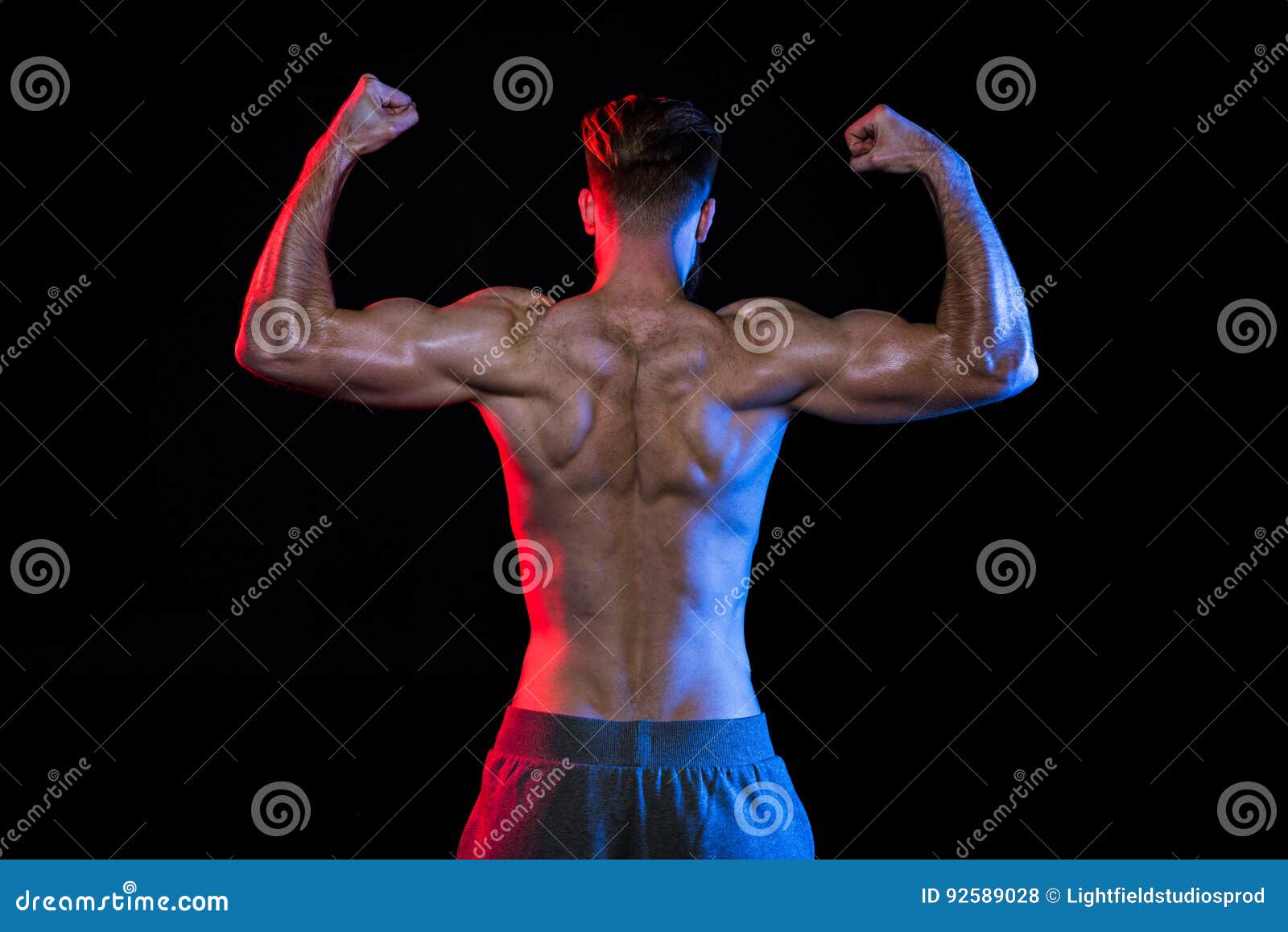 Shirtless Bodybuilder Gesturing Isolated on Black with Dramatic ...