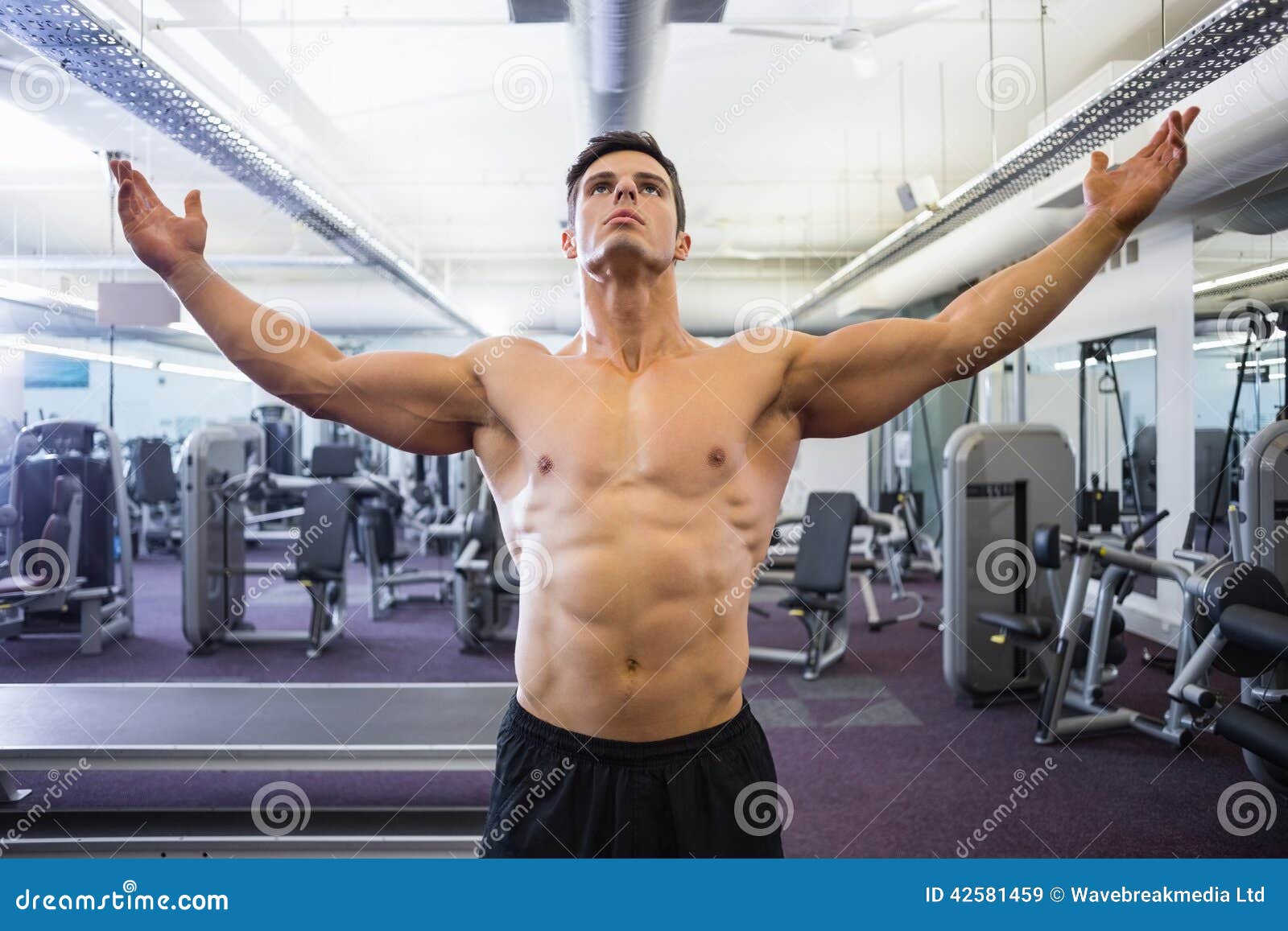 Shirtless Bodybuilder Standing in Gym Stock Image - Image of standing ...