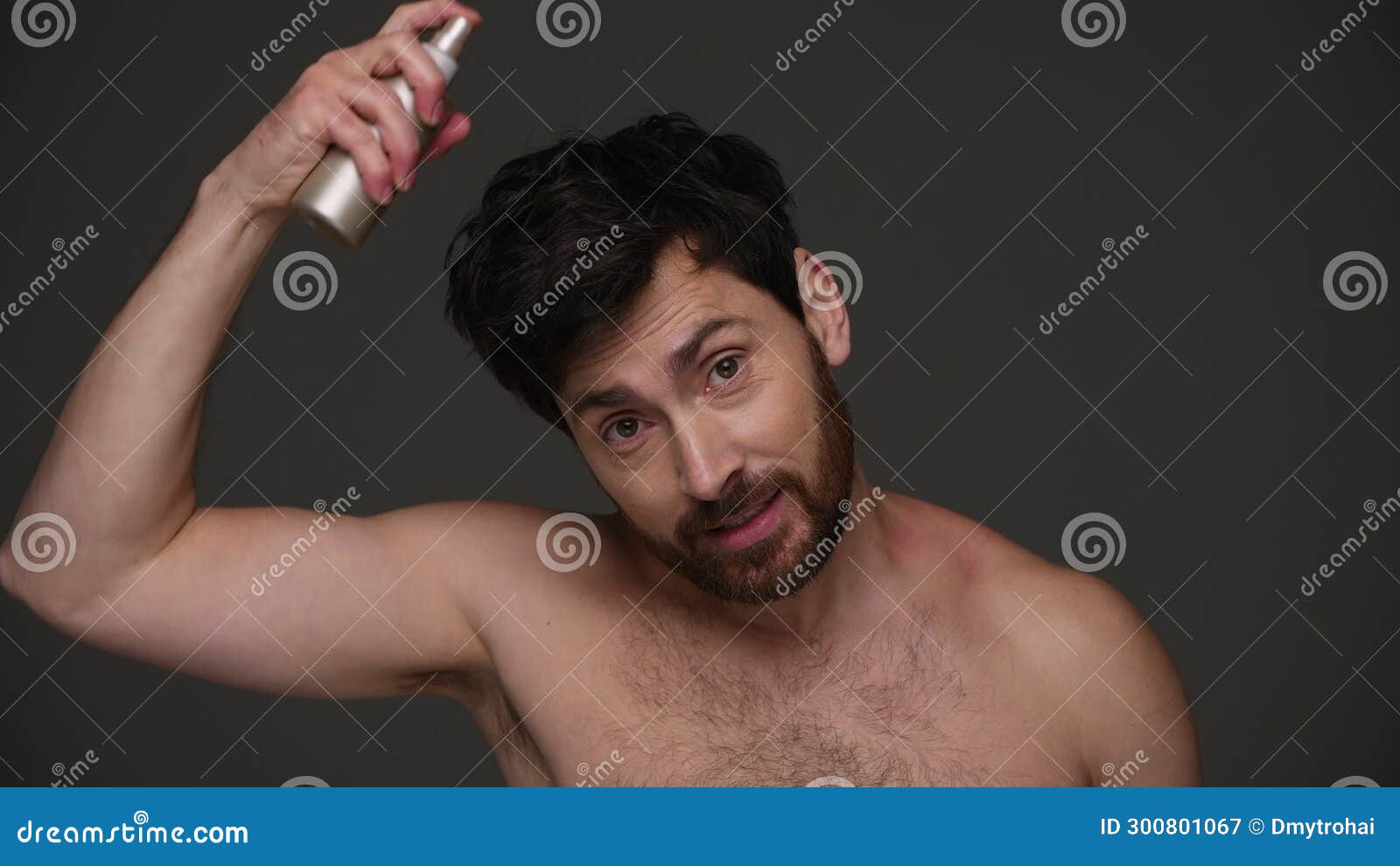 Shirtless and Disheveled Man Using Hairspray and Smiling Isolated on ...