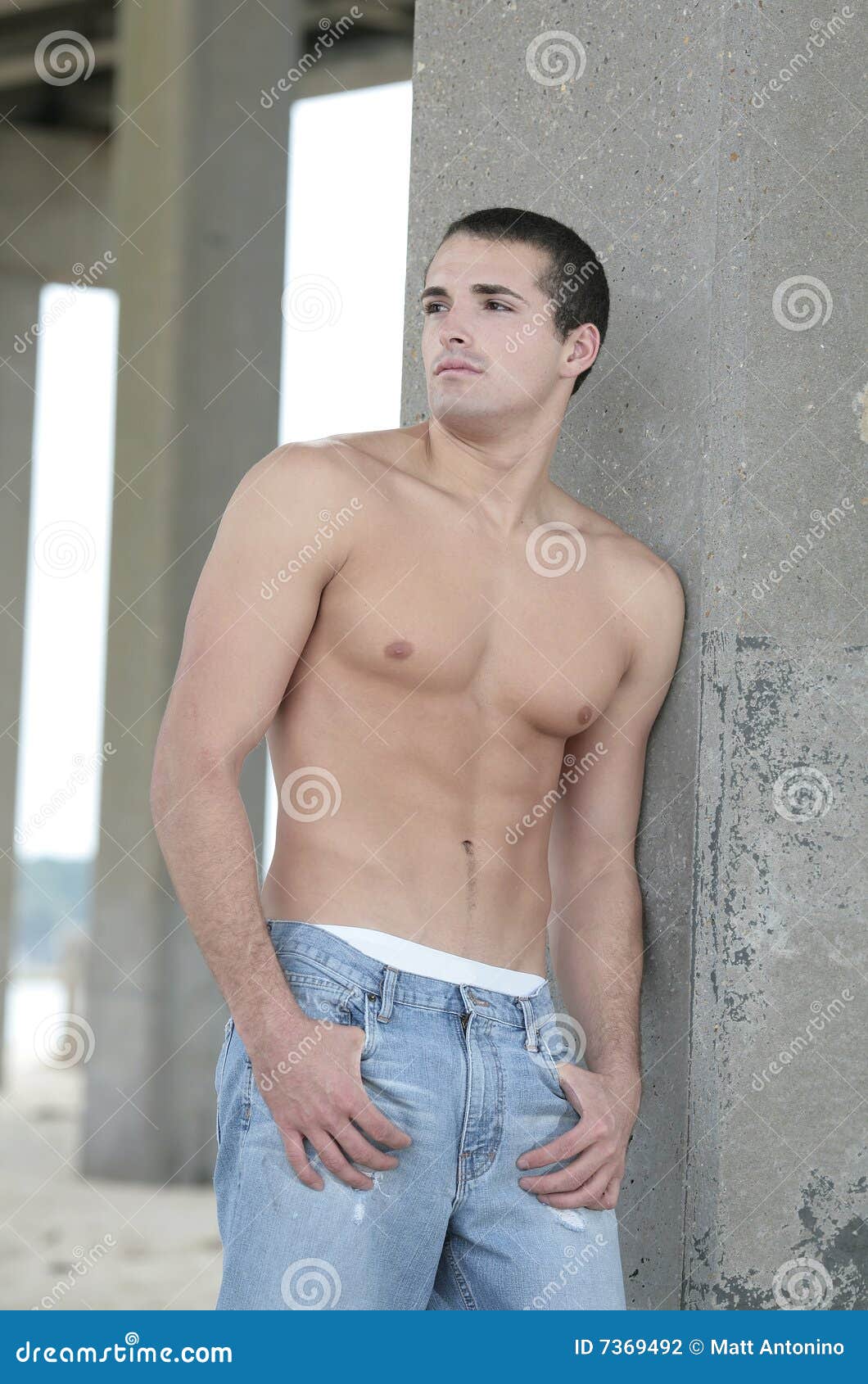 Shirtless guy at the beach stock photo. Image of muscular - 7369492