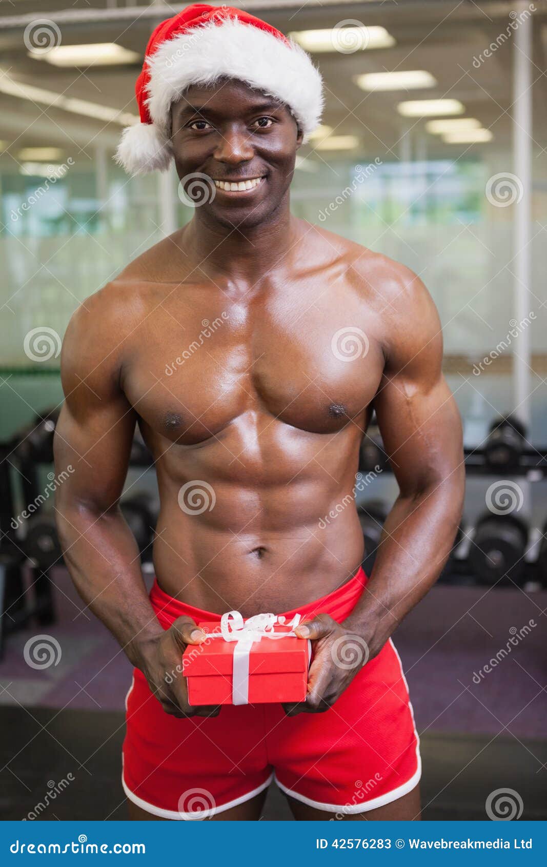 Shirtless Macho Man in Santa Hat Holding Gift Stock Image - Image of ...