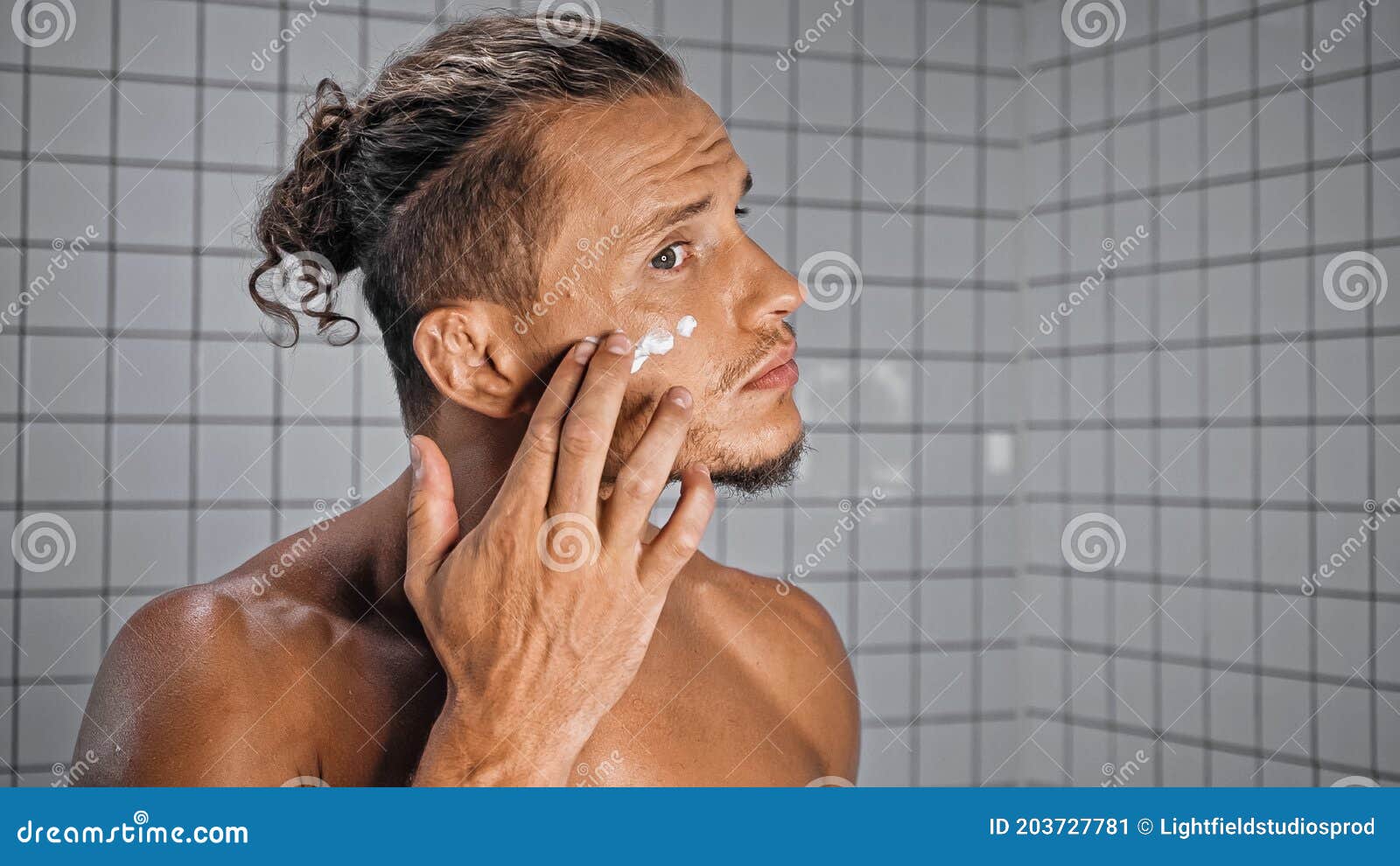 Young Shirtless Man Applying Face Cream Stock Image - Image of ...
