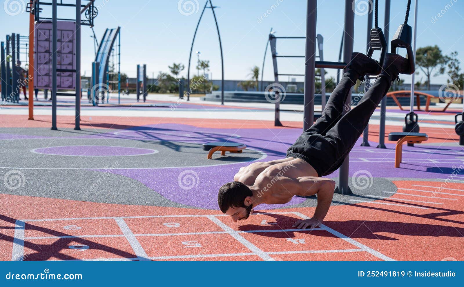 Shirtless Man Doing Loop Exercises Outdoors. Stock Image - Image of ...