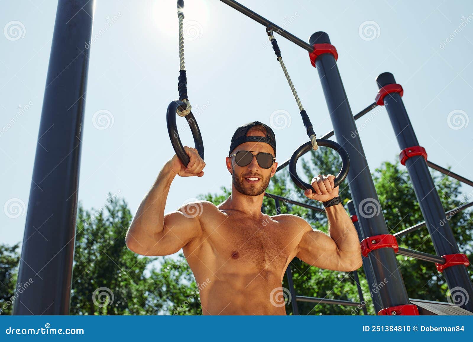 Shirtless Man Doing Loop Exercises Outdoors in Summer Park. Stock Photo ...