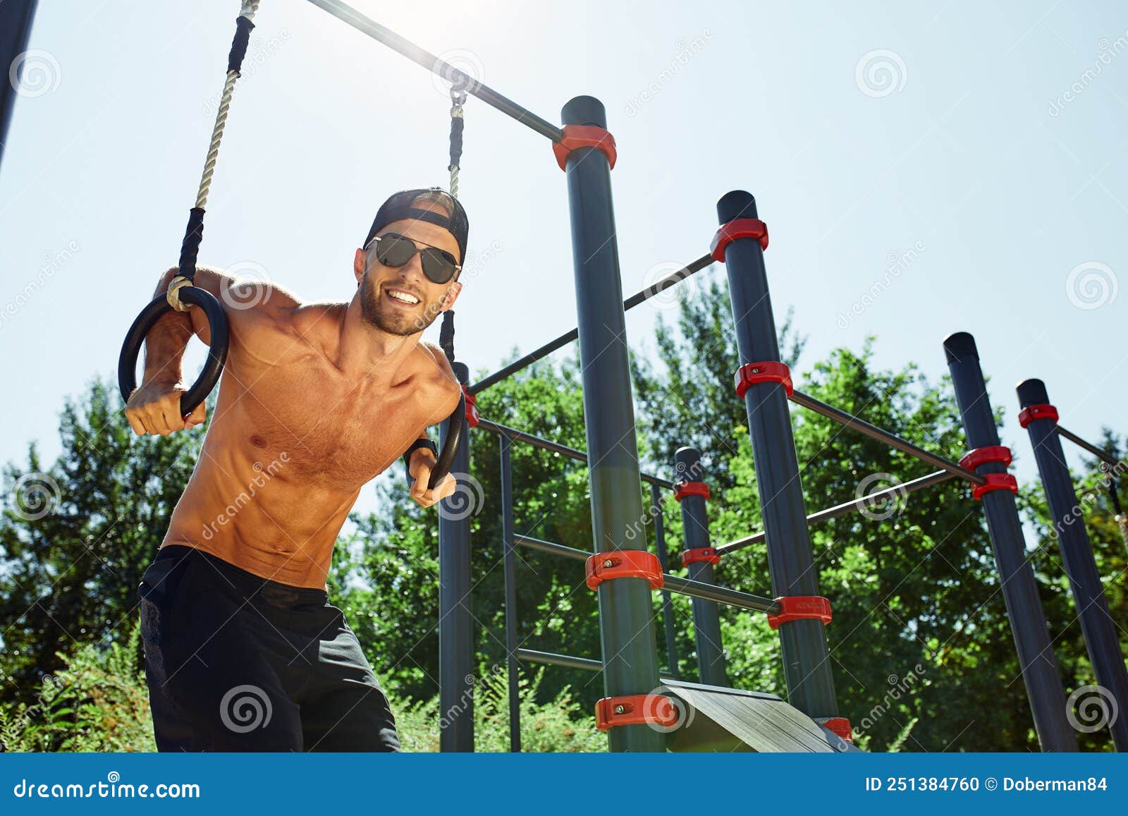 Shirtless Man Doing Loop Exercises Outdoors in Summer Park. Stock Photo ...