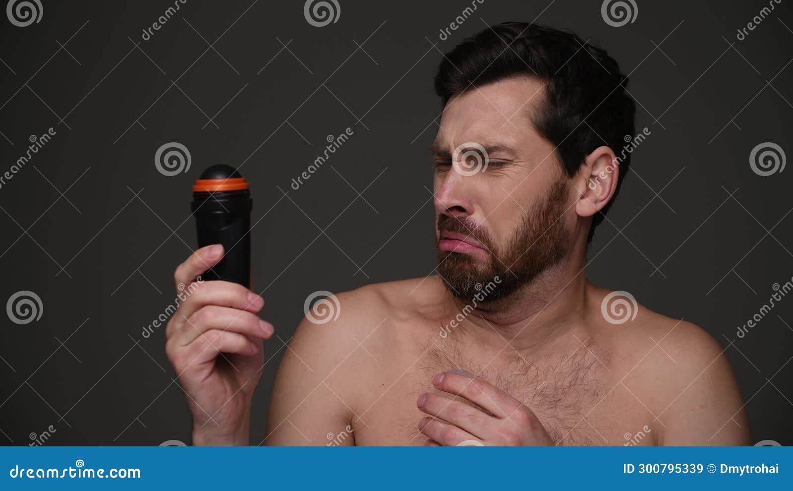 Shirtless Man Smiling while Smelling Deodorant Isolated on Dark Grey ...
