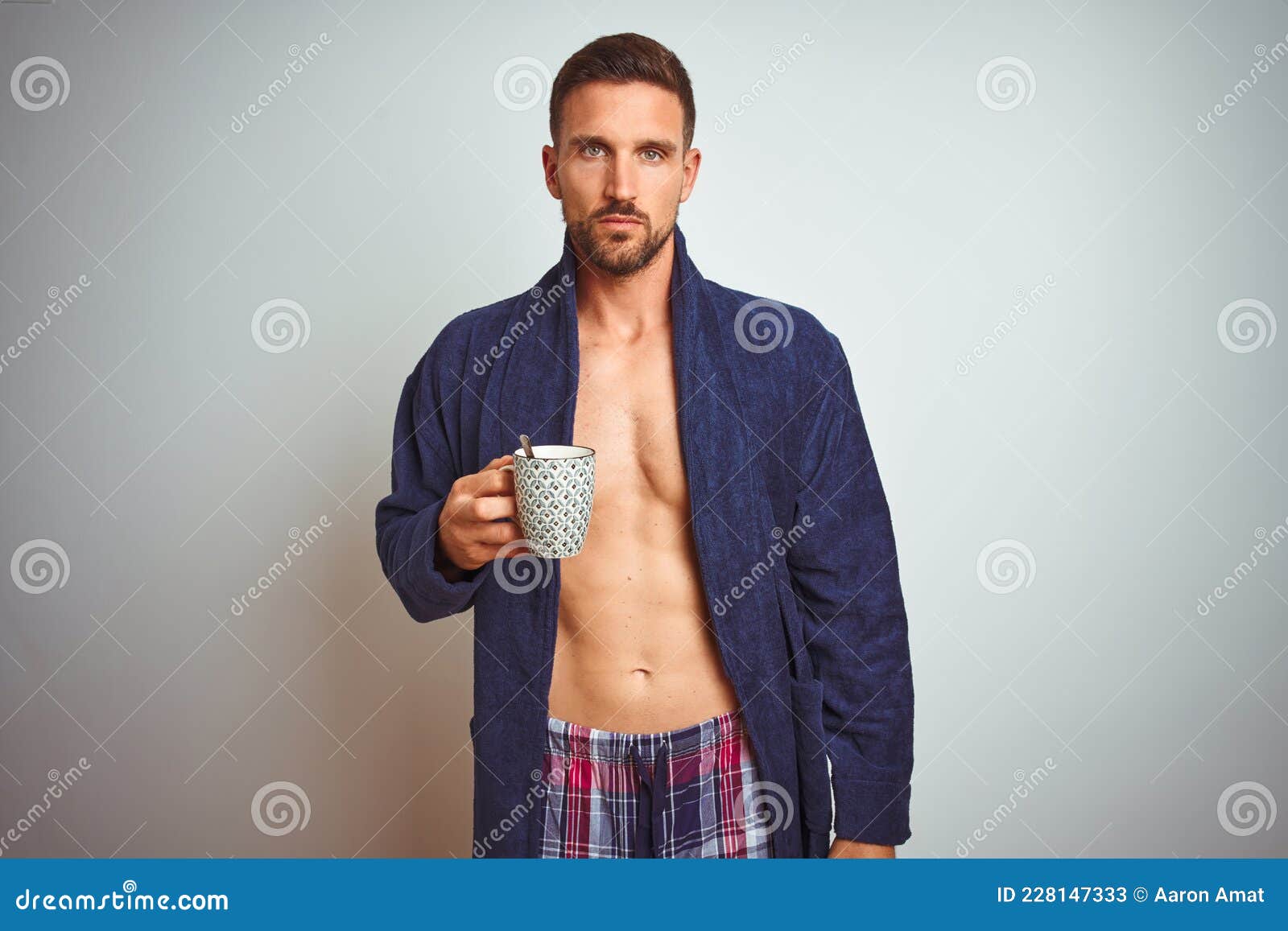 Shirtless Man Wearing Comfortable Pajamas and Robe Drinking Cup of ...