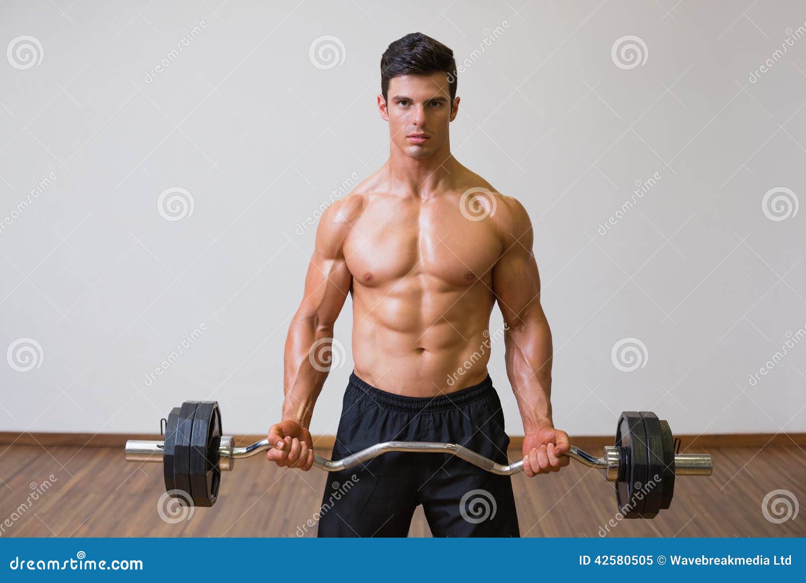 Shirtless Muscular Man Lifting Barbell In Gym Stock Image Image Of