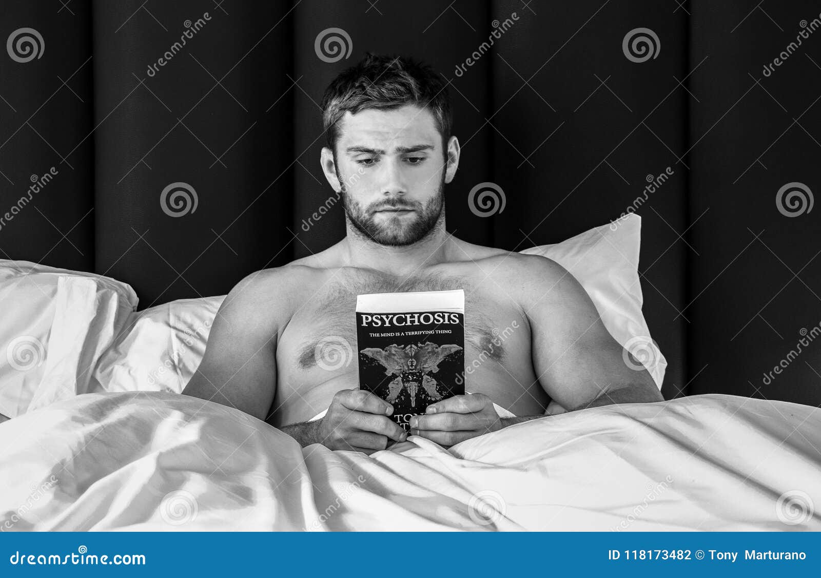 Shirtless Hunky Man With Beard Lies Naked In Bed Royalty Free Stock