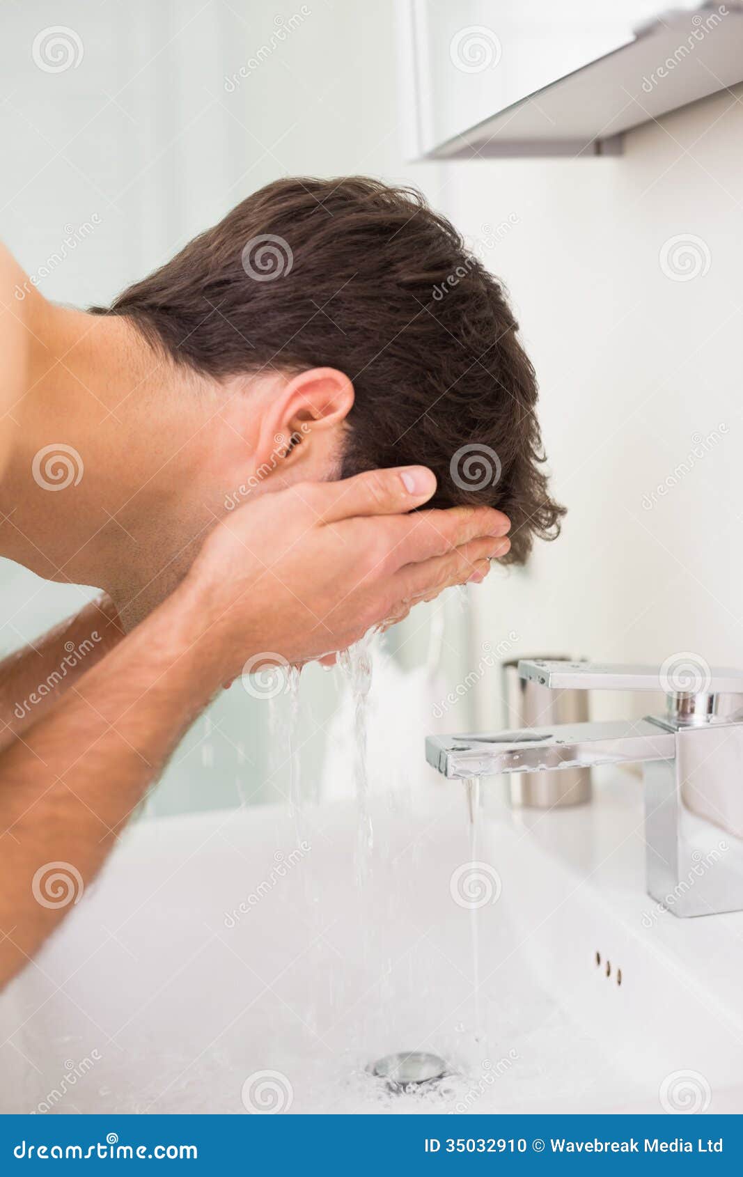 Shirtless Young Man Washing Face in Bathroom Stock Photo - Image of ...