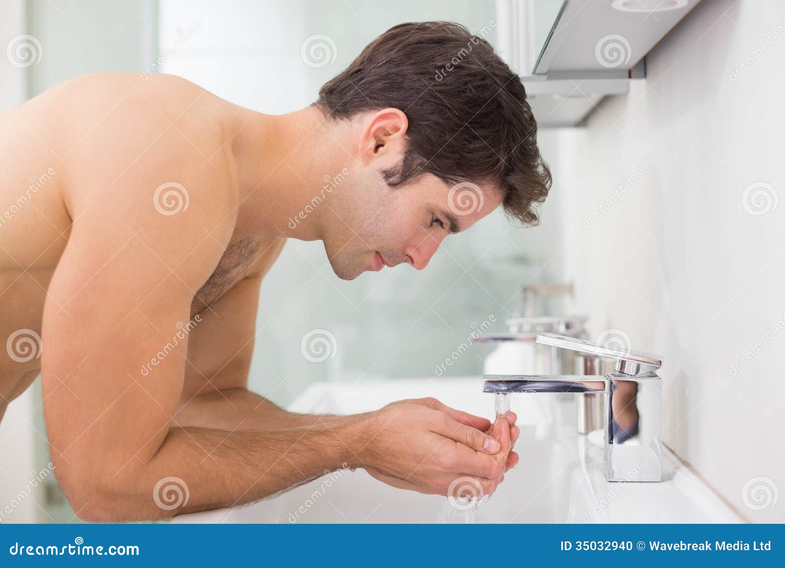 Shirtless Young Man Washing Face in Bathroom Stock Photo - Image of ...