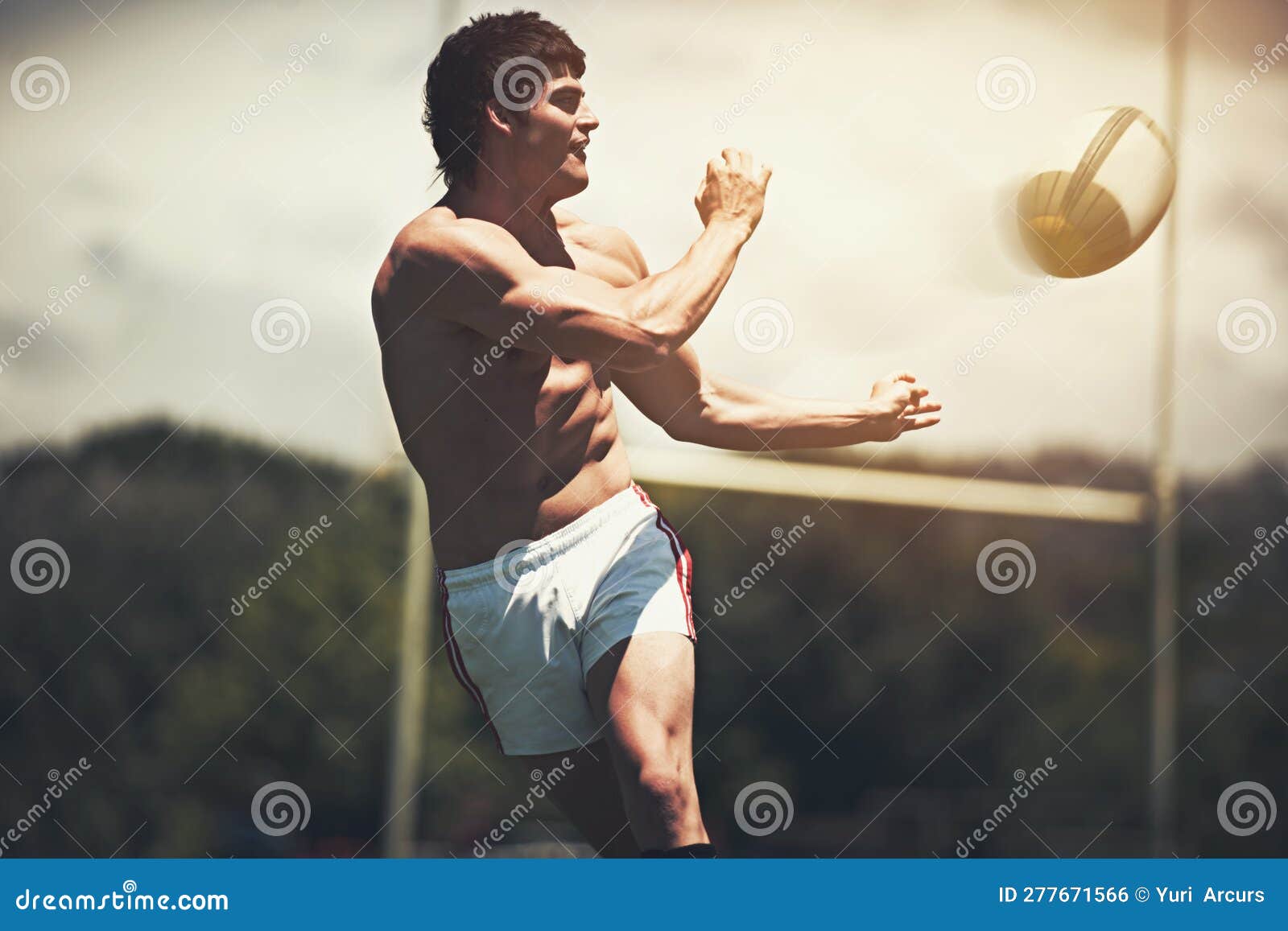 Shirts Vs. Skins. a Shirtless Rugby Player Executing a Pass during a ...