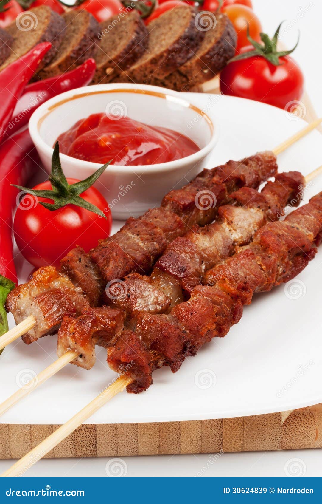 Shish Kebab on Bamboo Sticks on White Plate Stock Image - Image of ...