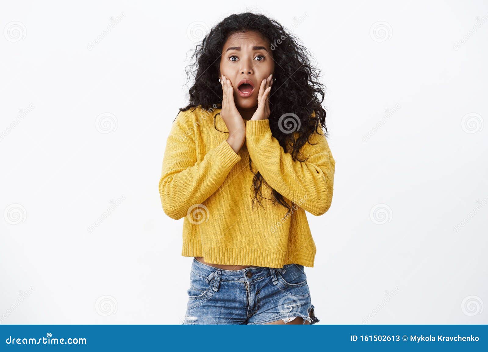 Shocked And Alarmed Worried Curly Haired African American Woman In