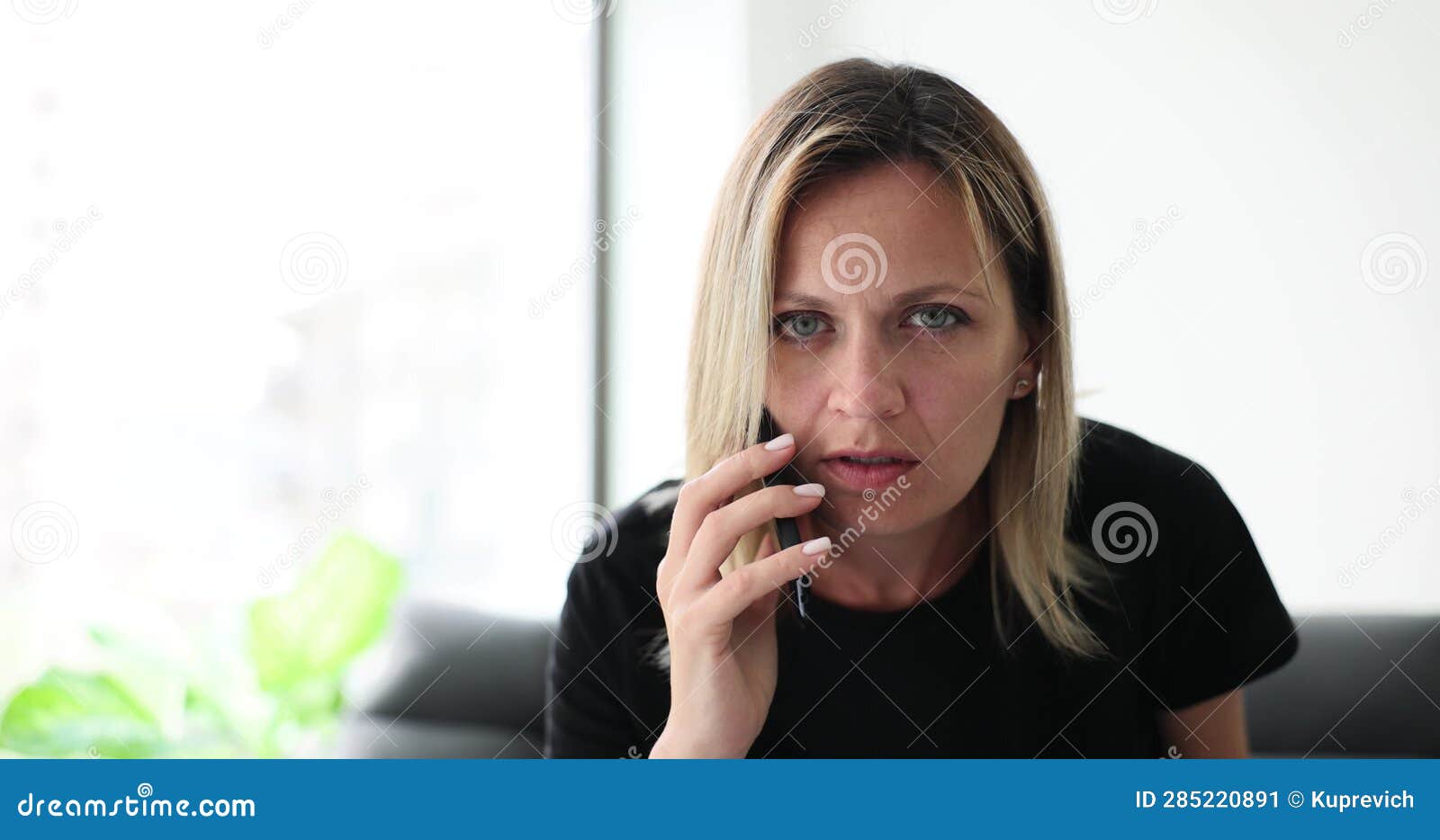 Shocked Annoyed Woman Talking On Mobile Phone Looking At Camera Stock