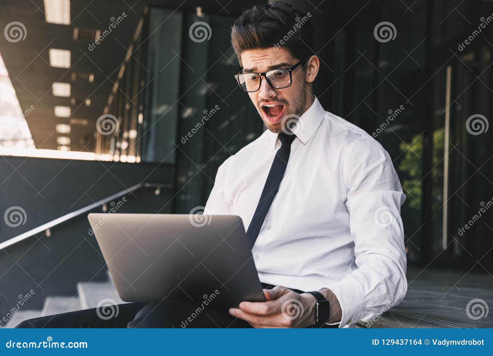 Shocked Business Man Near Business Center Using Laptop Computer. Stock ...