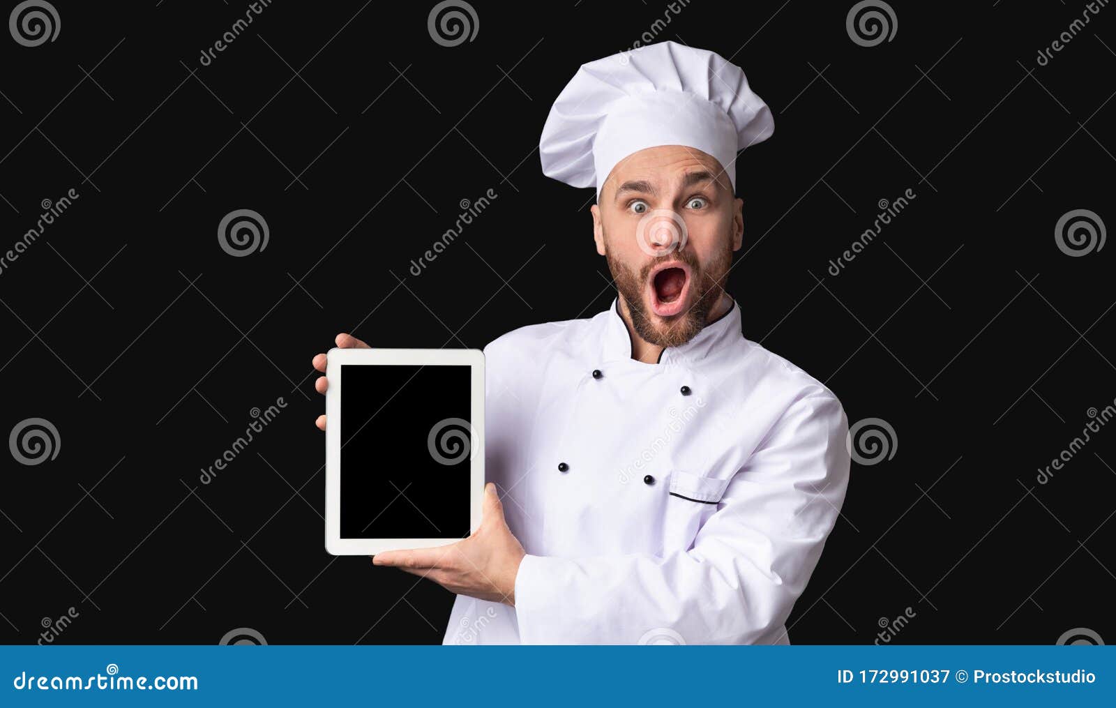 Shocked Chef Holding Digital Tablet Standing in Studio, Mockup Stock ...