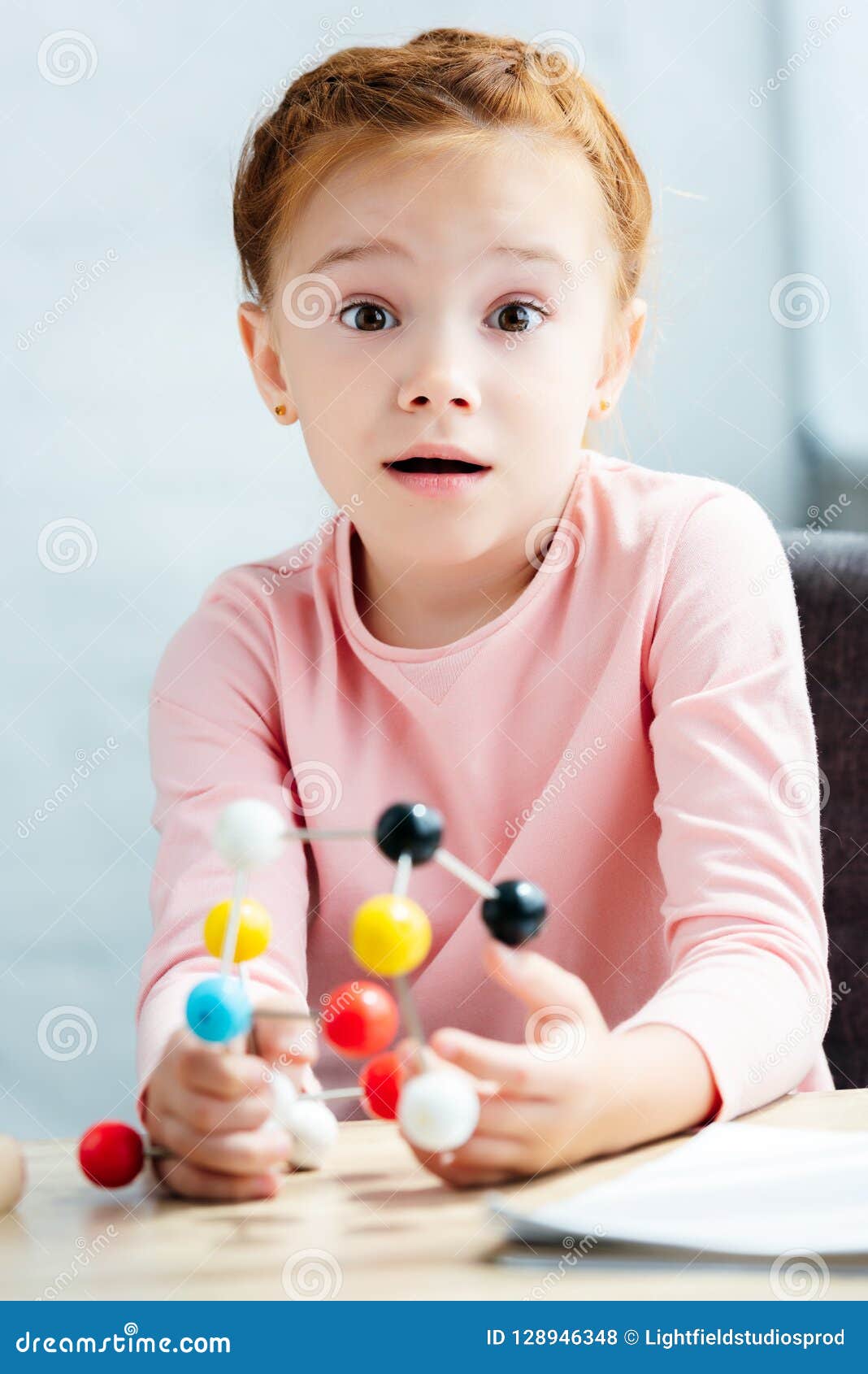 Shocked Child Holding Molecular Model and Looking Stock Photo - Image ...