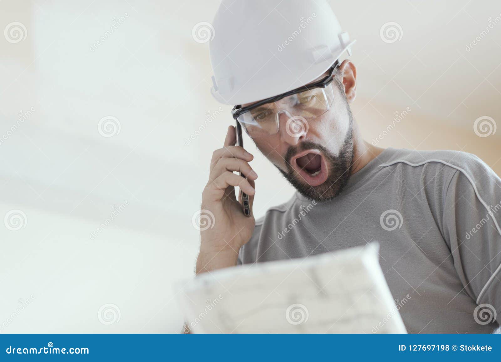 Shocked Construction Engineer Having a Phone Call Stock Photo - Image ...