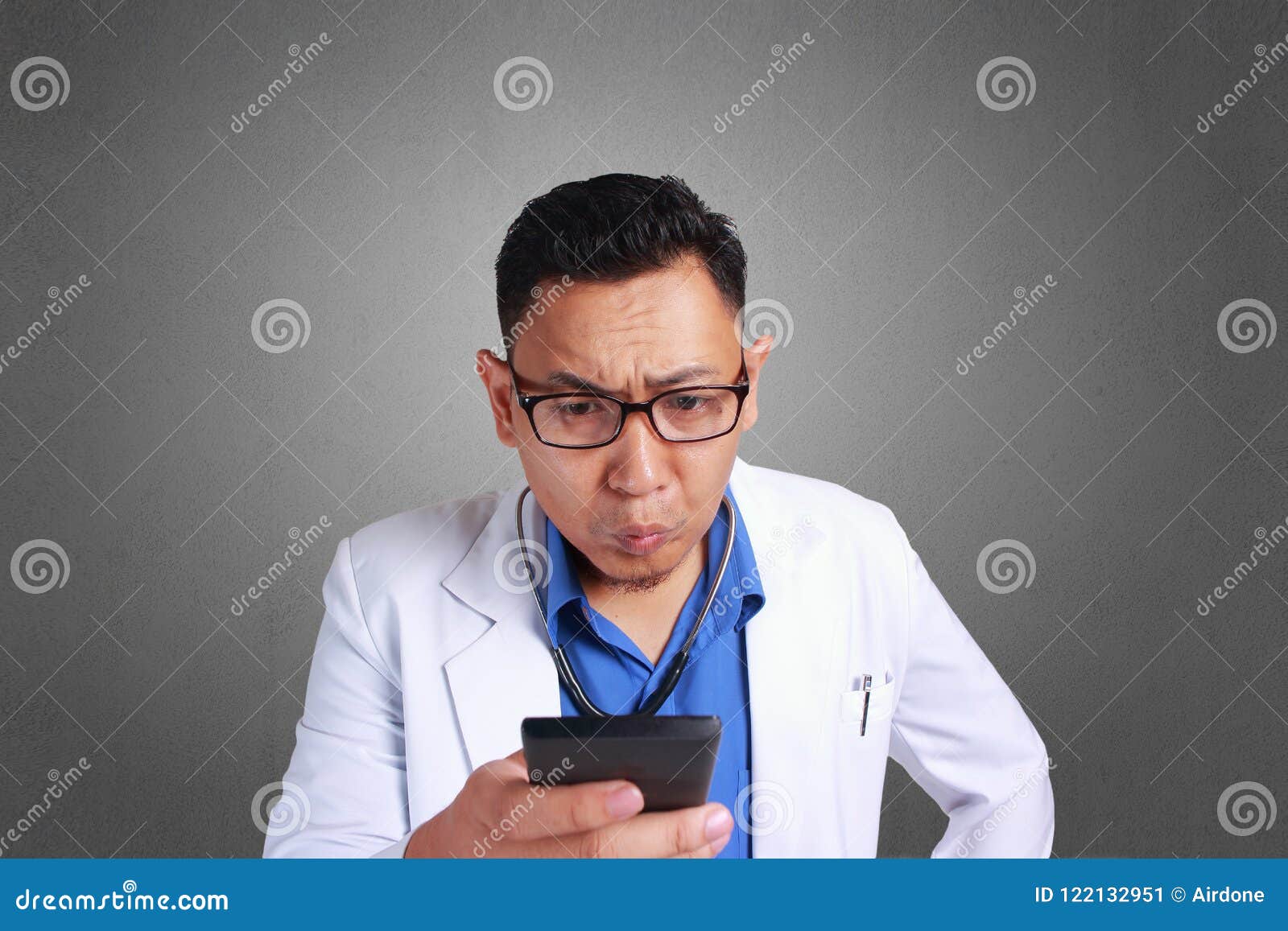 Shocked Doctor Expression Reading Text on Phone Stock Image - Image of ...