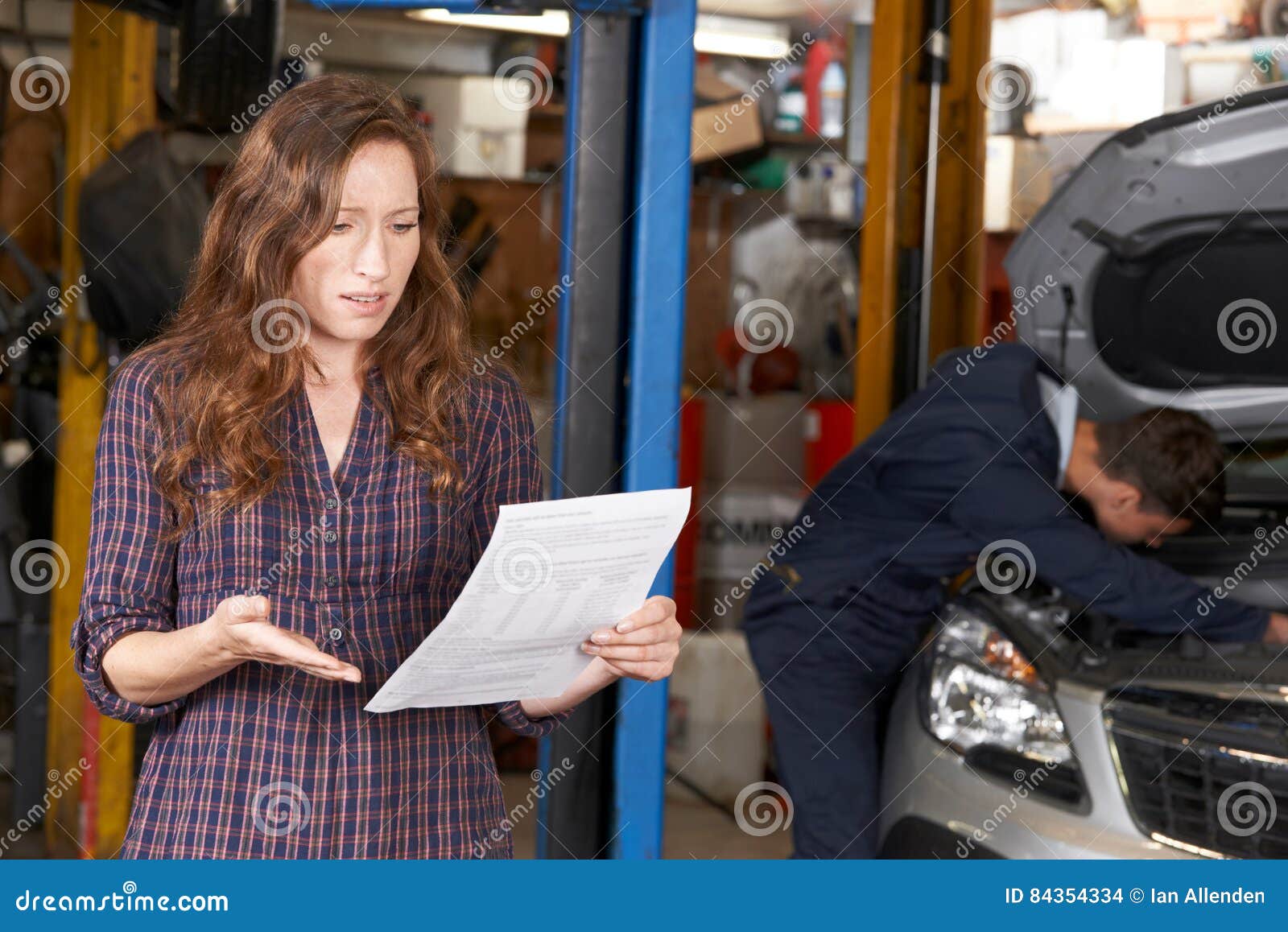 Shocked Female Customer Looking at Garage Bill Stock Photo - Image of ...