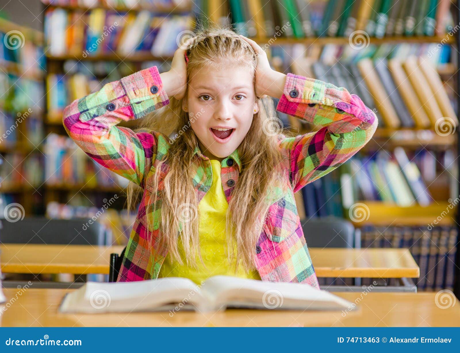 Shocked Girl Reading a Book in the Library Stock Image - Image of book ...