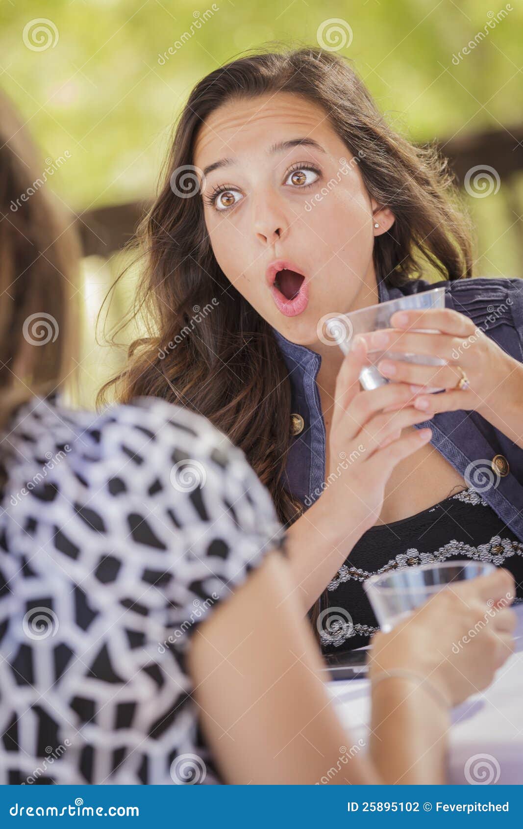 Shocked Girl Talking with Friend Outdoors Stock Photo - Image of mixed ...
