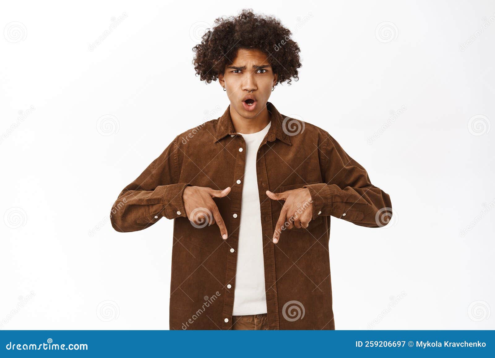 Shocked Guy Pointing Fingers Down, Looking Concerned, Standing Over ...