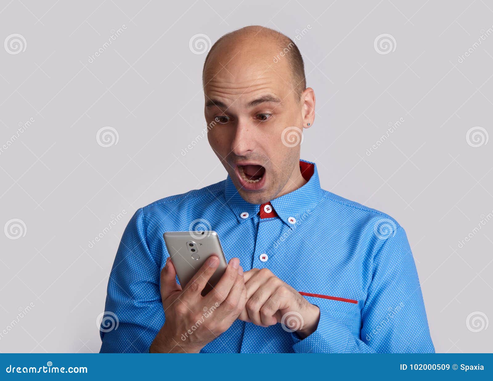 Shocked Guy Reading Message on His Smartphone Stock Image - Image of ...