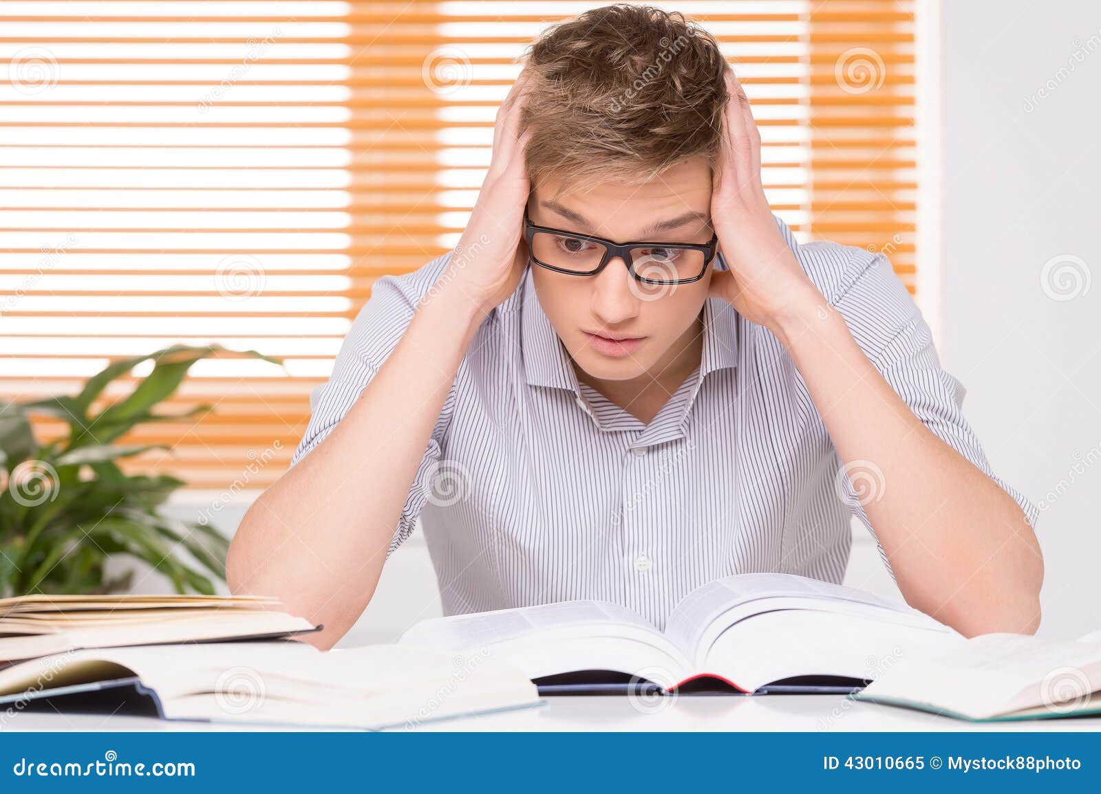 Shocked Male Student Working in Studio. Stock Image - Image of desk ...