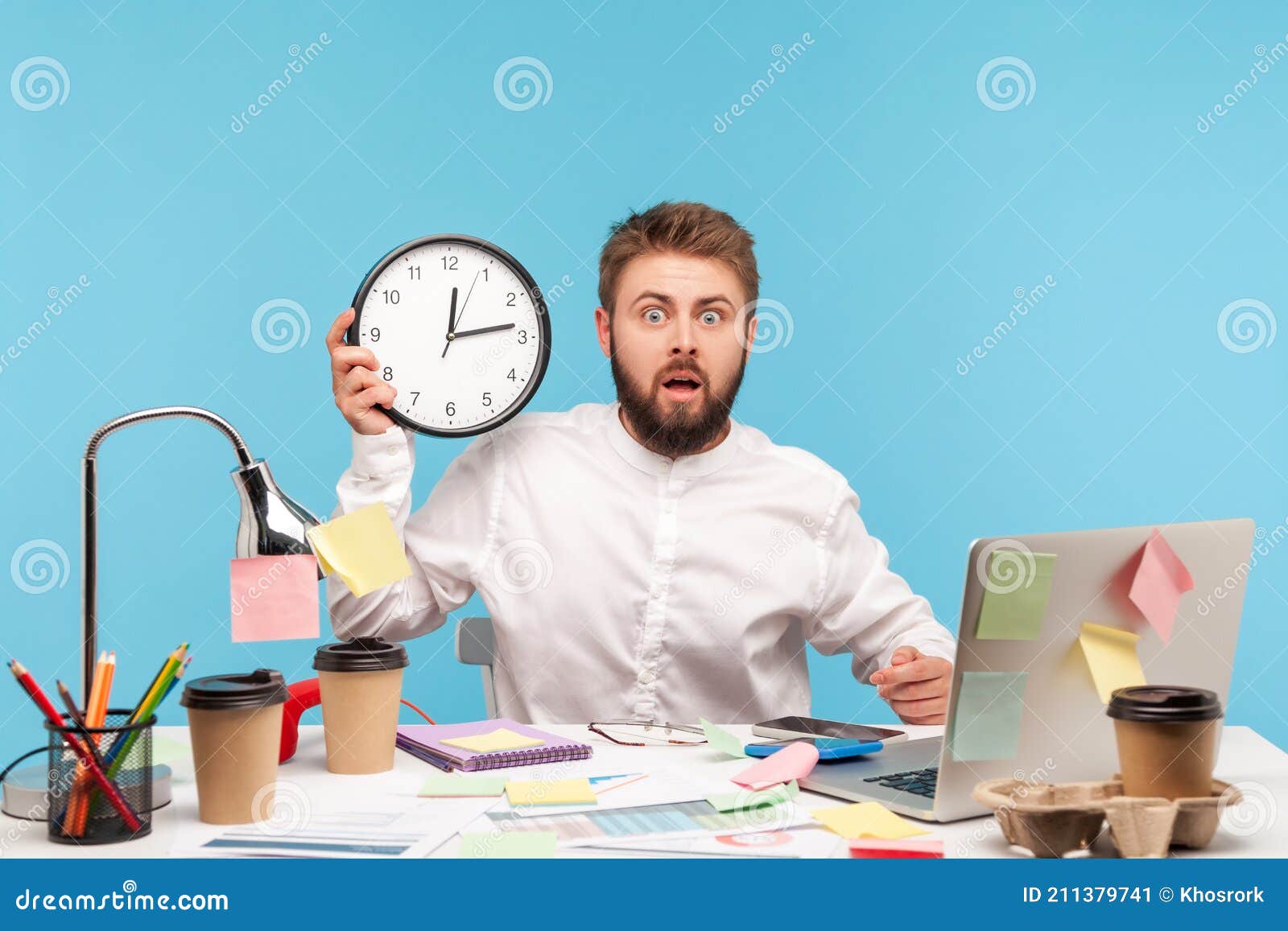 Shocked Man in Hurry Holding Wall Clock and Looking at Camera with ...
