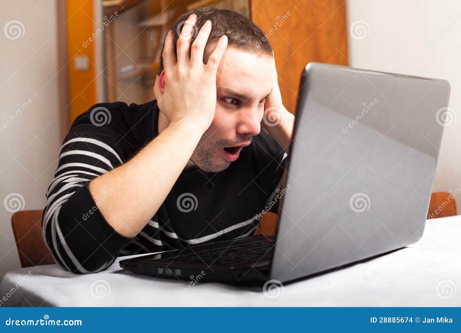 Shocked man with laptop stock photo. Image of people - 28885674