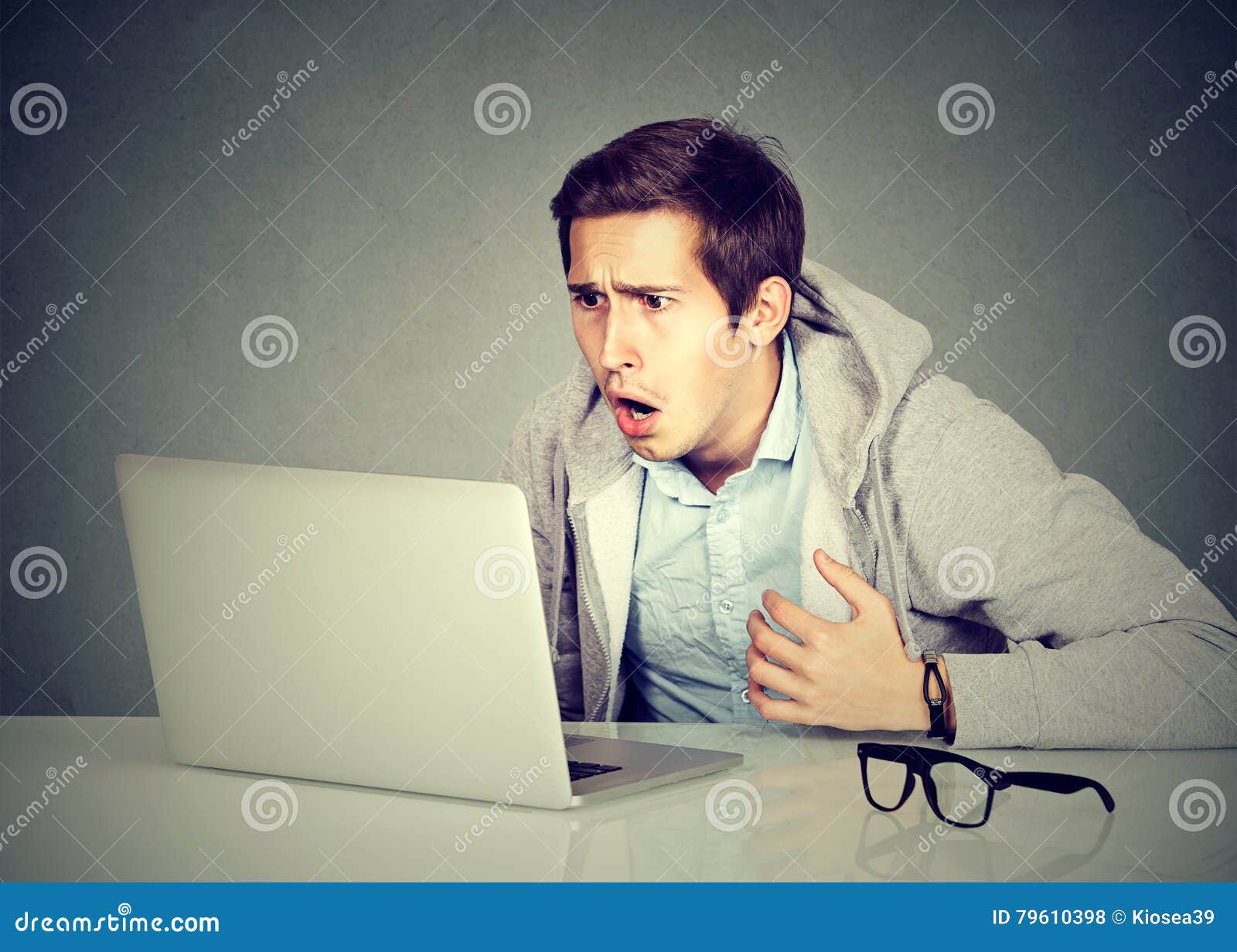 Shocked Man with Laptop Computer Sitting at Table Stock Photo - Image ...