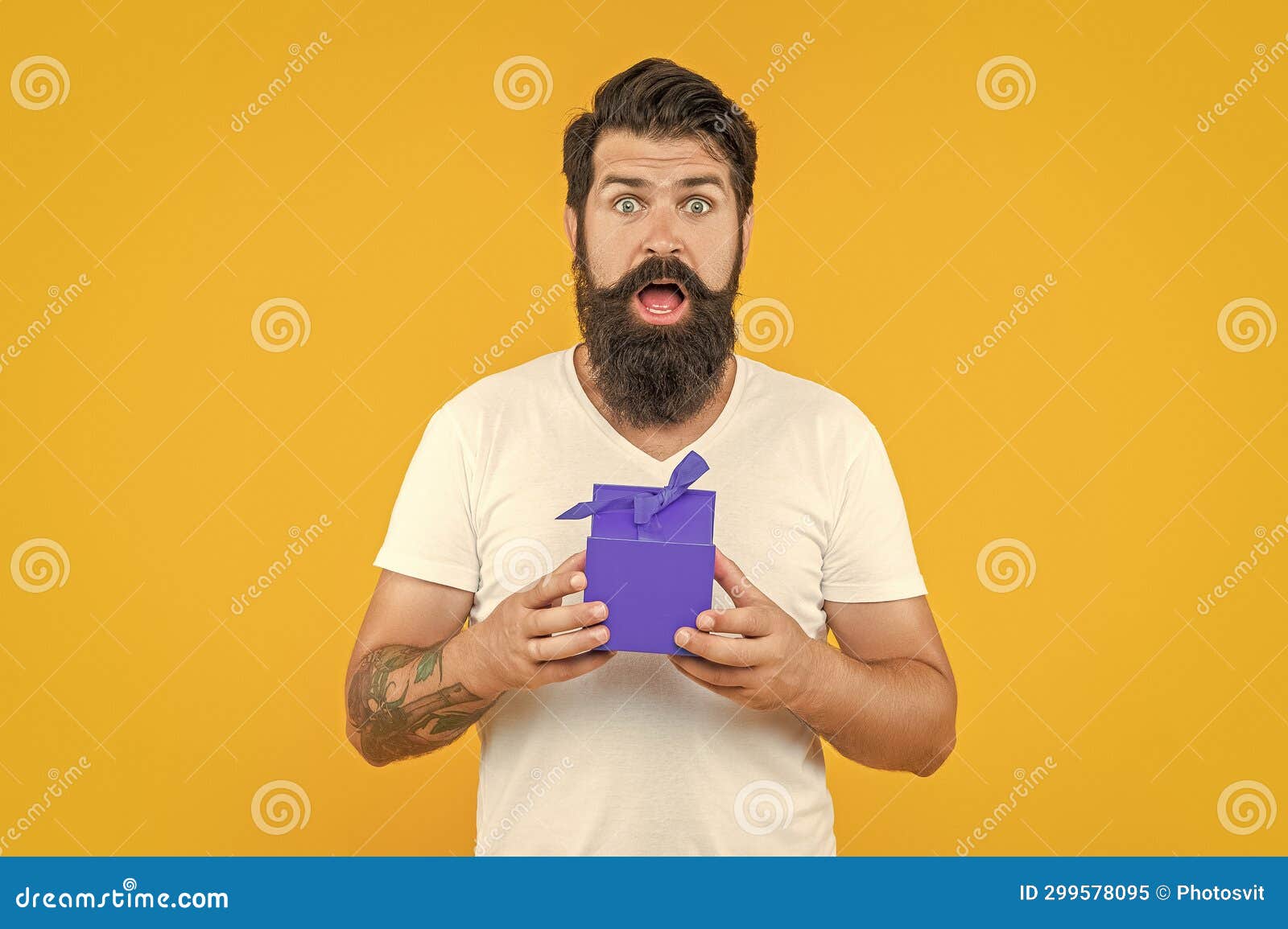 Shocked Man with Present Box Isolated on Yellow. Man with Present Box ...